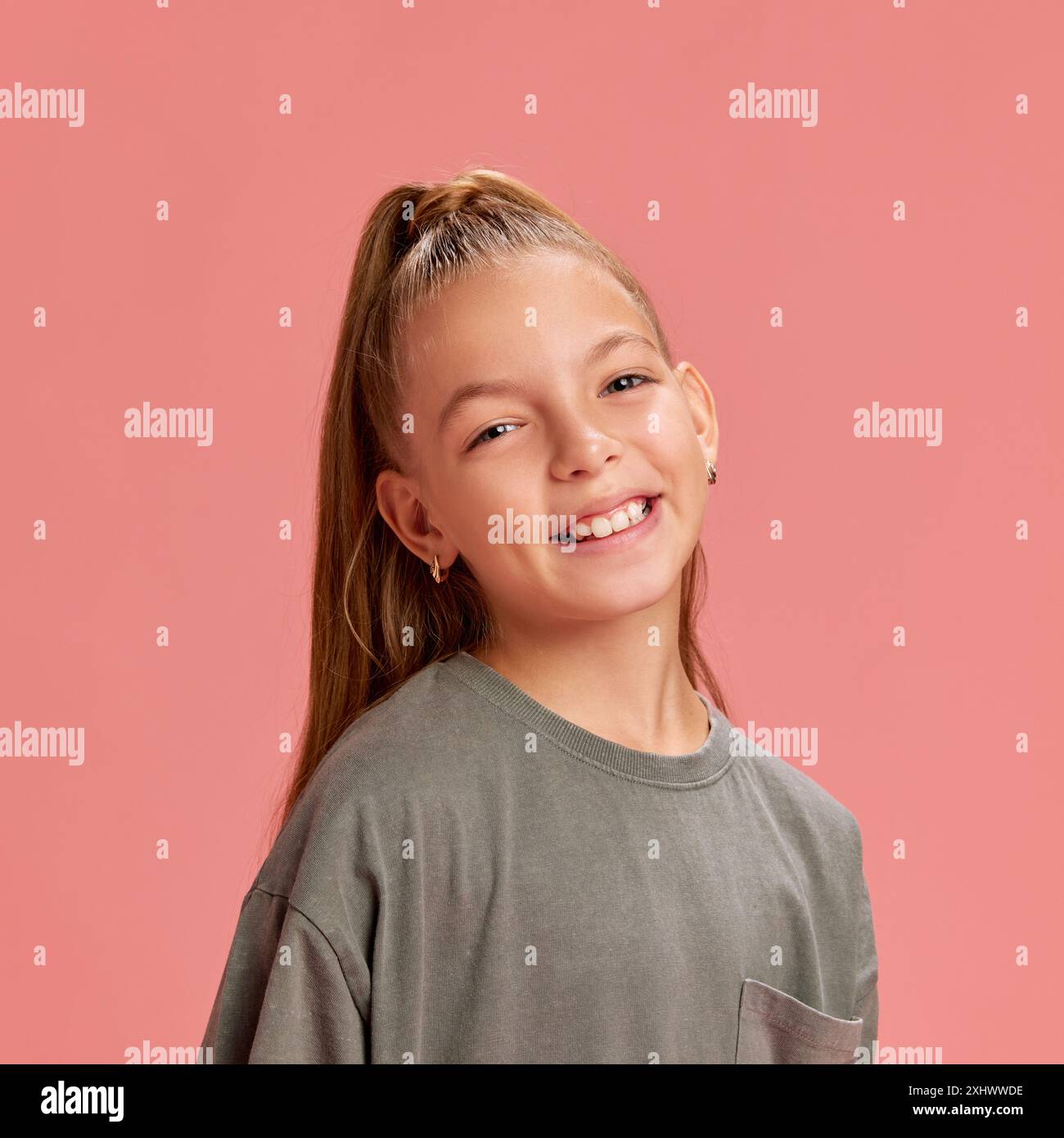 Portrait of attracting young girl, 9 years old child posing with smile ...