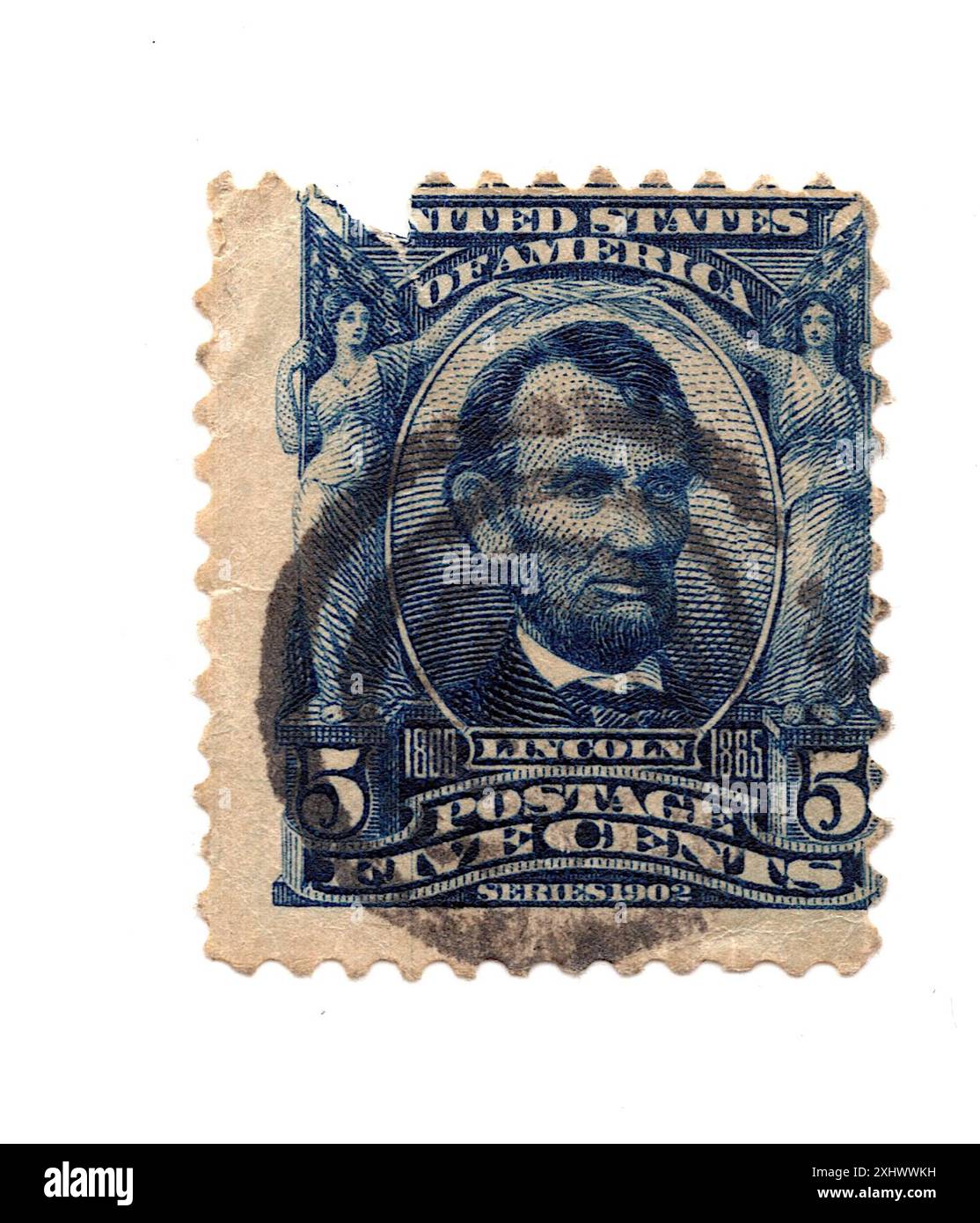 A vintage Abraham Lincoln postage stamp from the USA on a white ...