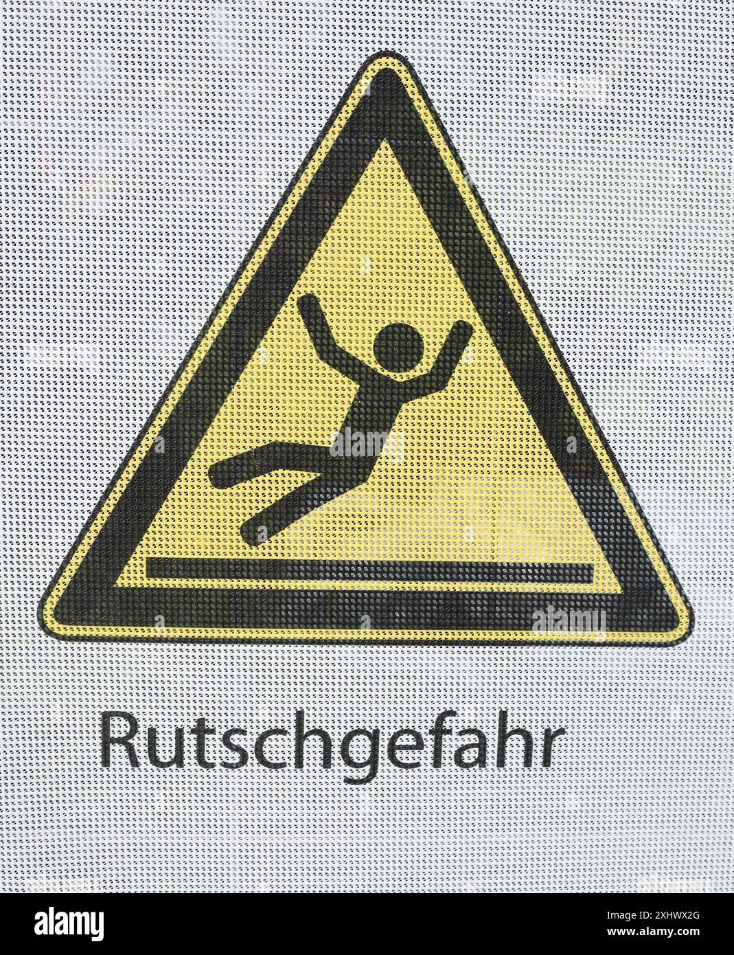 Yellow warning sign Danger of slipping, Germany Stock Photo - Alamy
