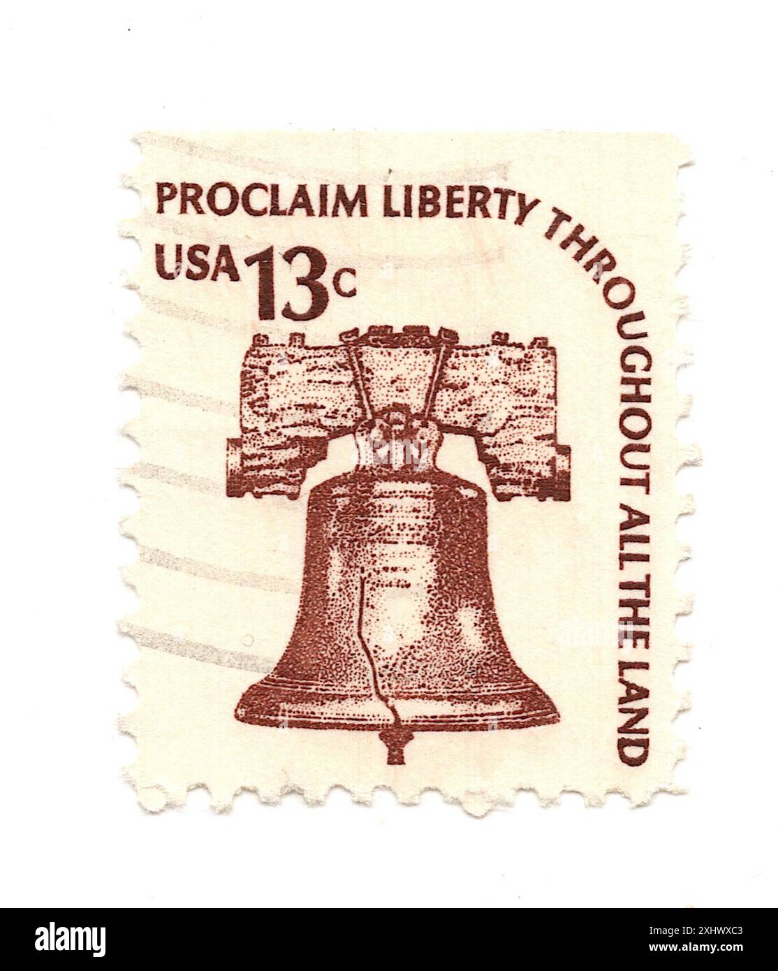 A vintage Liberty Bell postage stamp from the USA on a white background ...