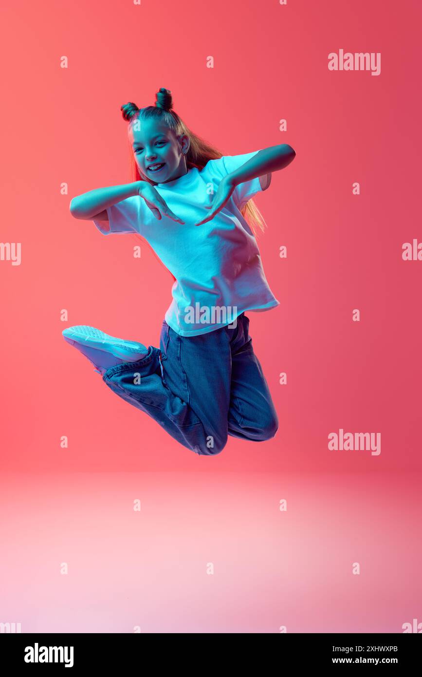 Full-length portrait of happy young girl in white t-shirt and jeans ...