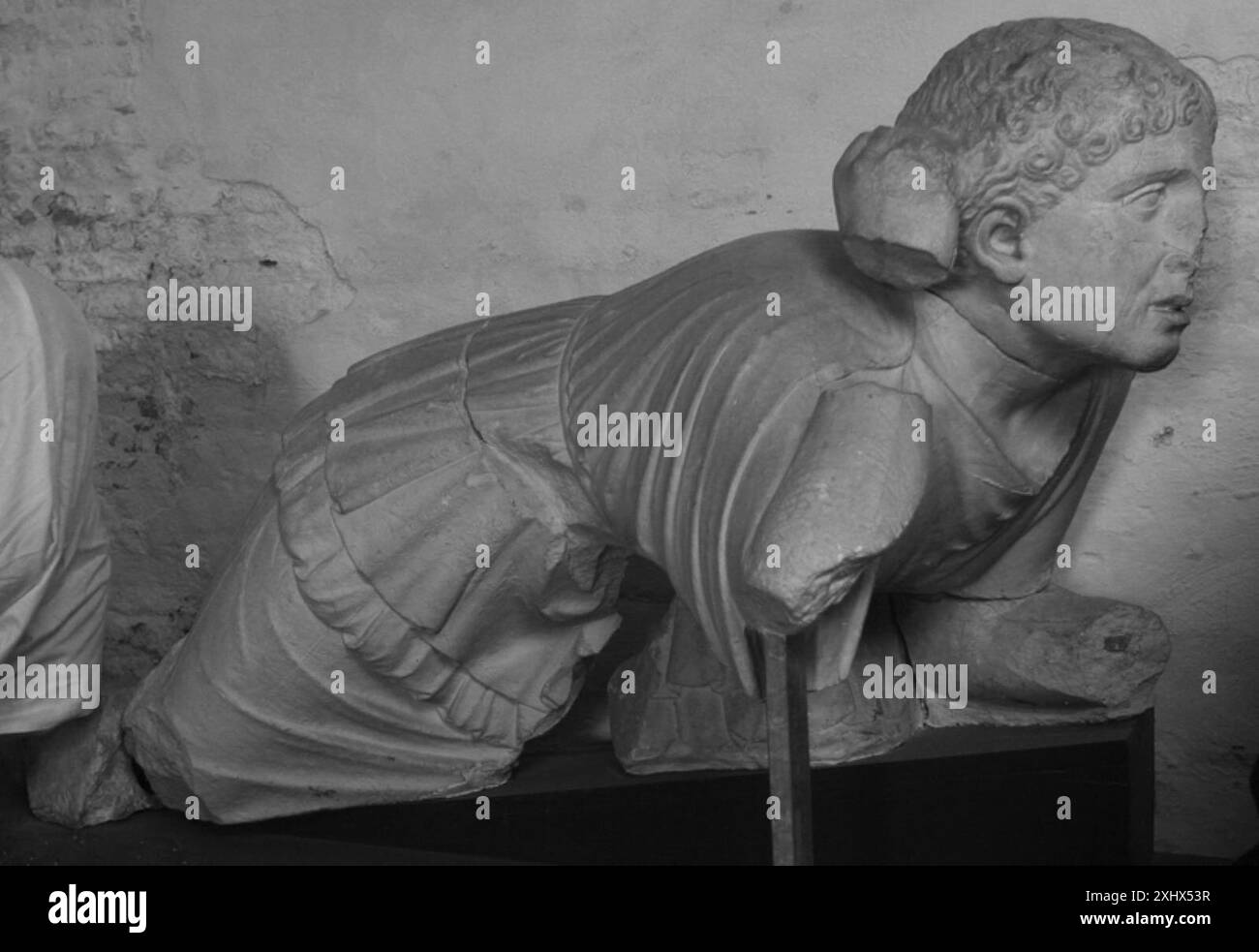 Statue of an elderly woman lying at the left gable corner, artist and ...