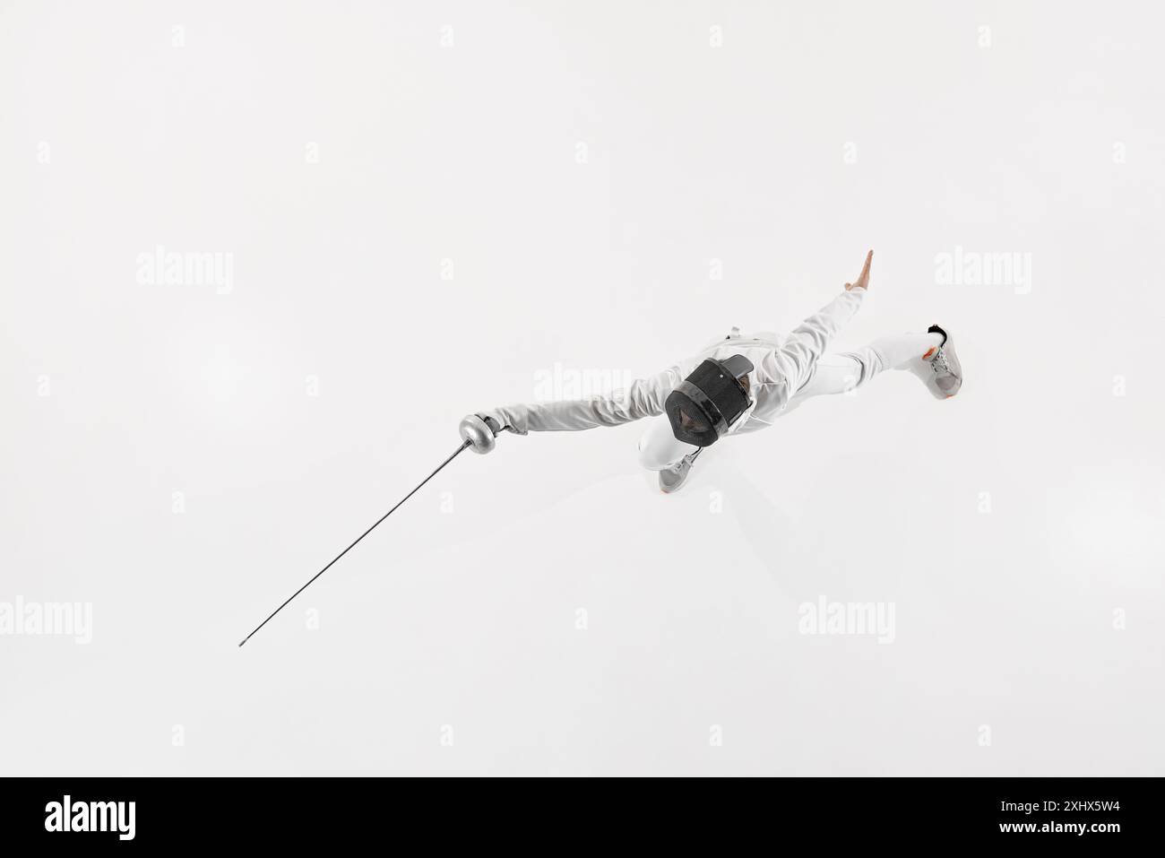 Top-down view of fencer in action, lunging with his epee performing his ...