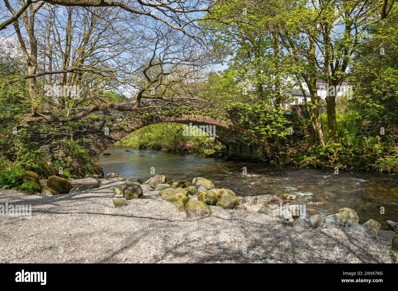 Stone arch bridge across River Derwent in spring Longthwaite Borrowdale ...