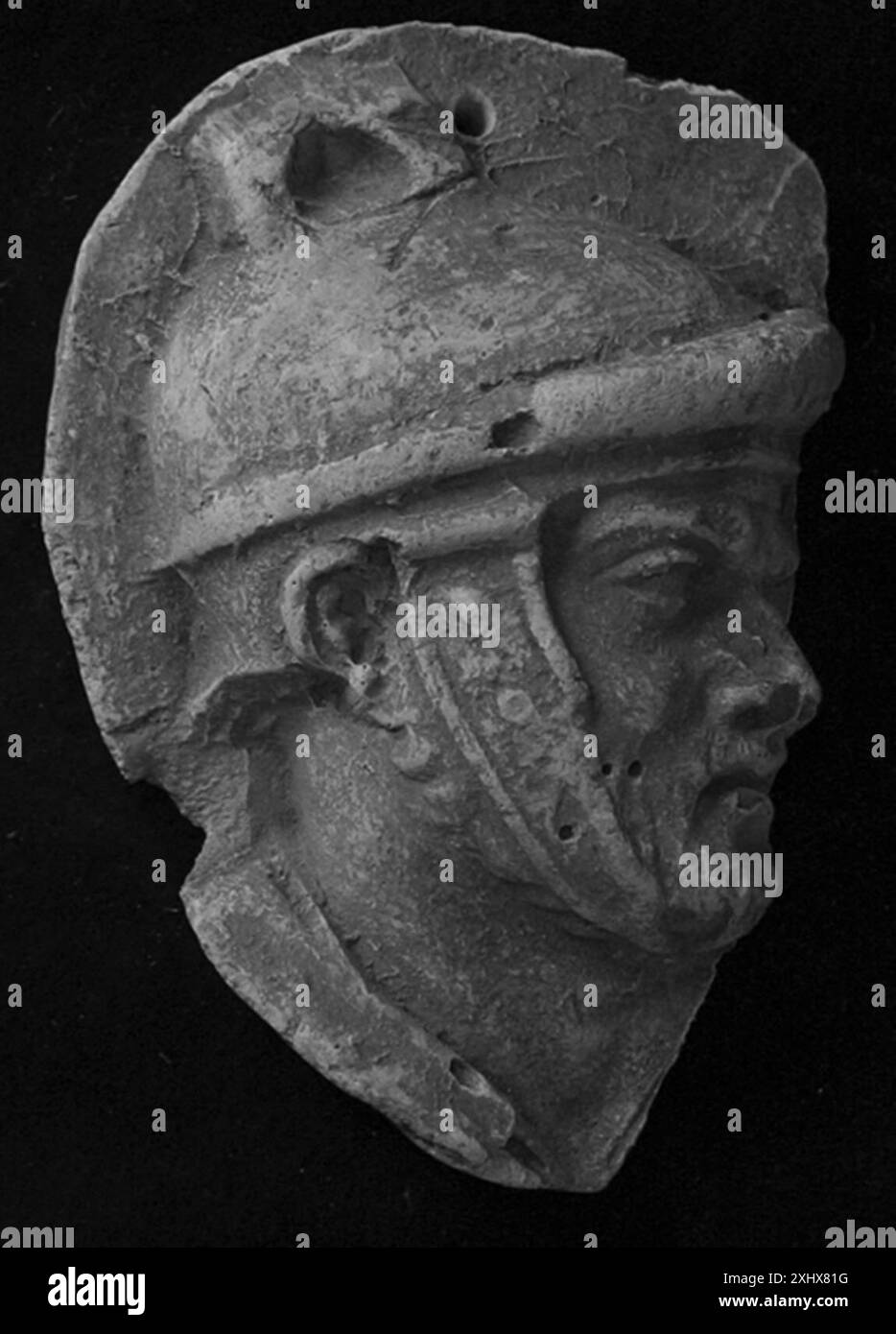 This artwork shows a man's head in left profile from Trajan's Column ...
