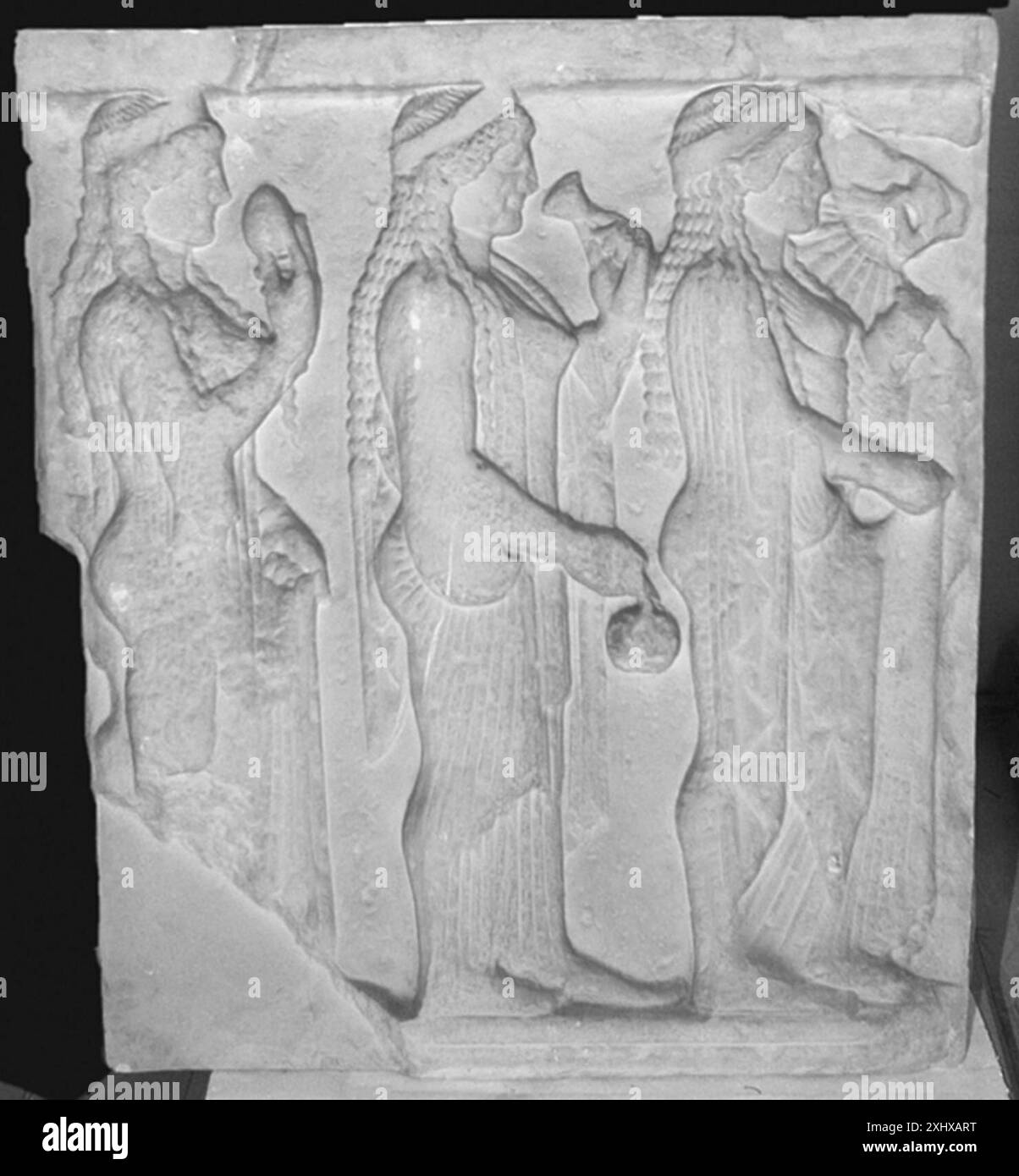 Sitting and standing figure opposite each other flanked by sirens ...