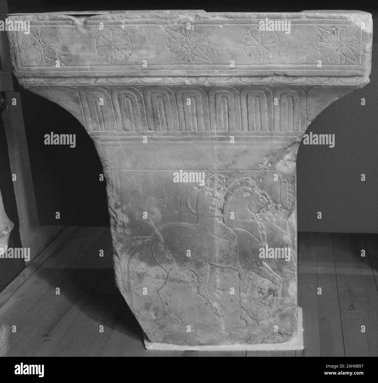 Stone capital from a tomb stele depicting a rider, crying women, and an ...