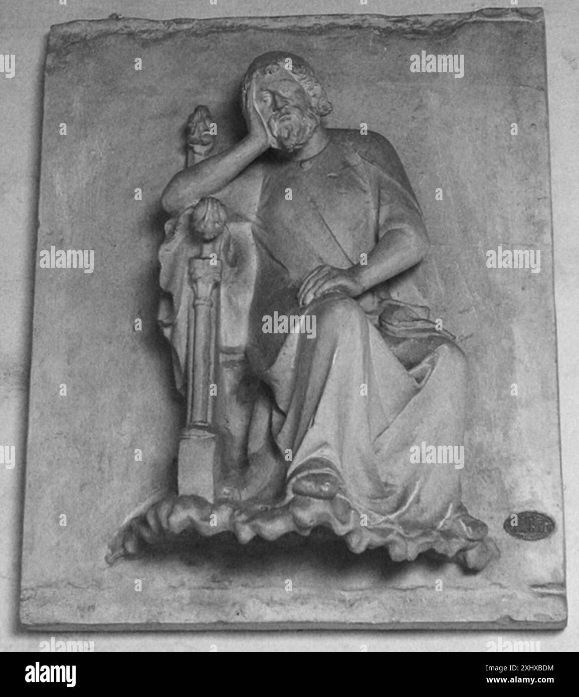 Relief showing a seated, thoughtful man with a beard, emphasizing ...