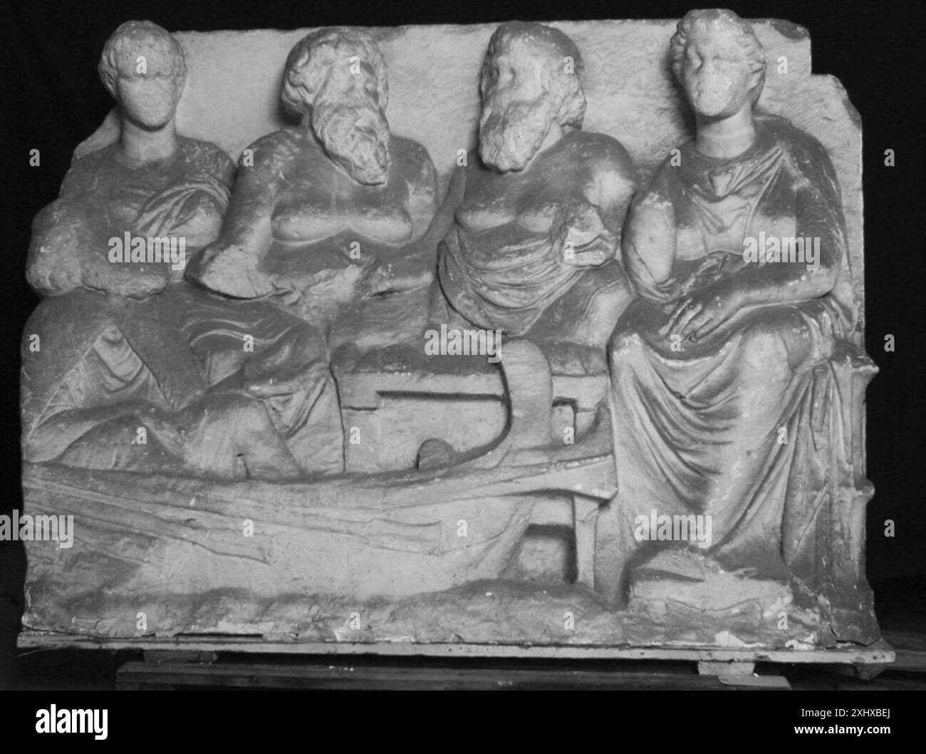 Two men women seated Black and White Stock Photos & Images - Alamy