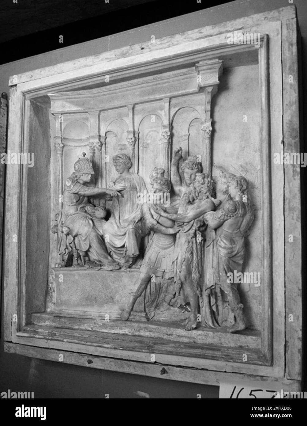 A relief depicting John the Baptist presented to Herod, carved in stone ...