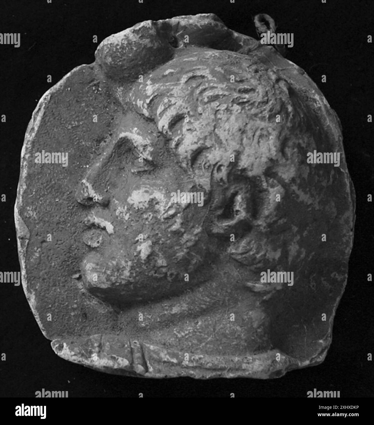A detailed left-profile view of a male head from the Trajan Column ...
