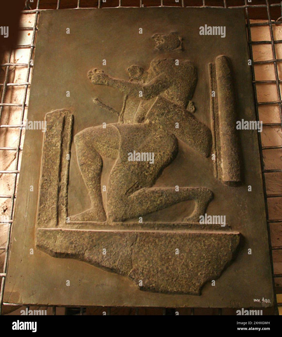 A relief showing an archer positioned to the left, depicting detailed ...