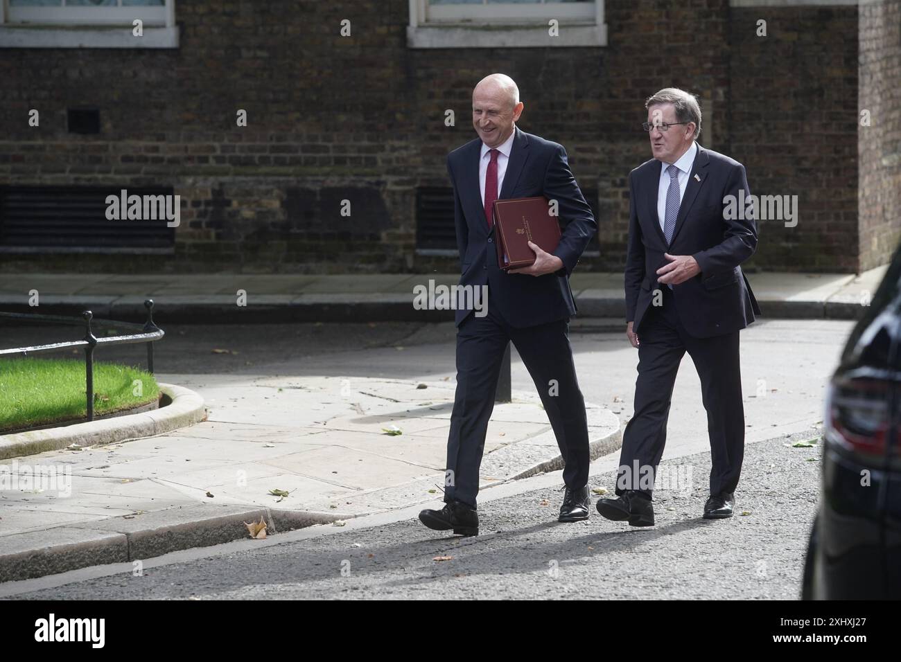 Secretary of State for Defence John Healey (left) walks with former ...