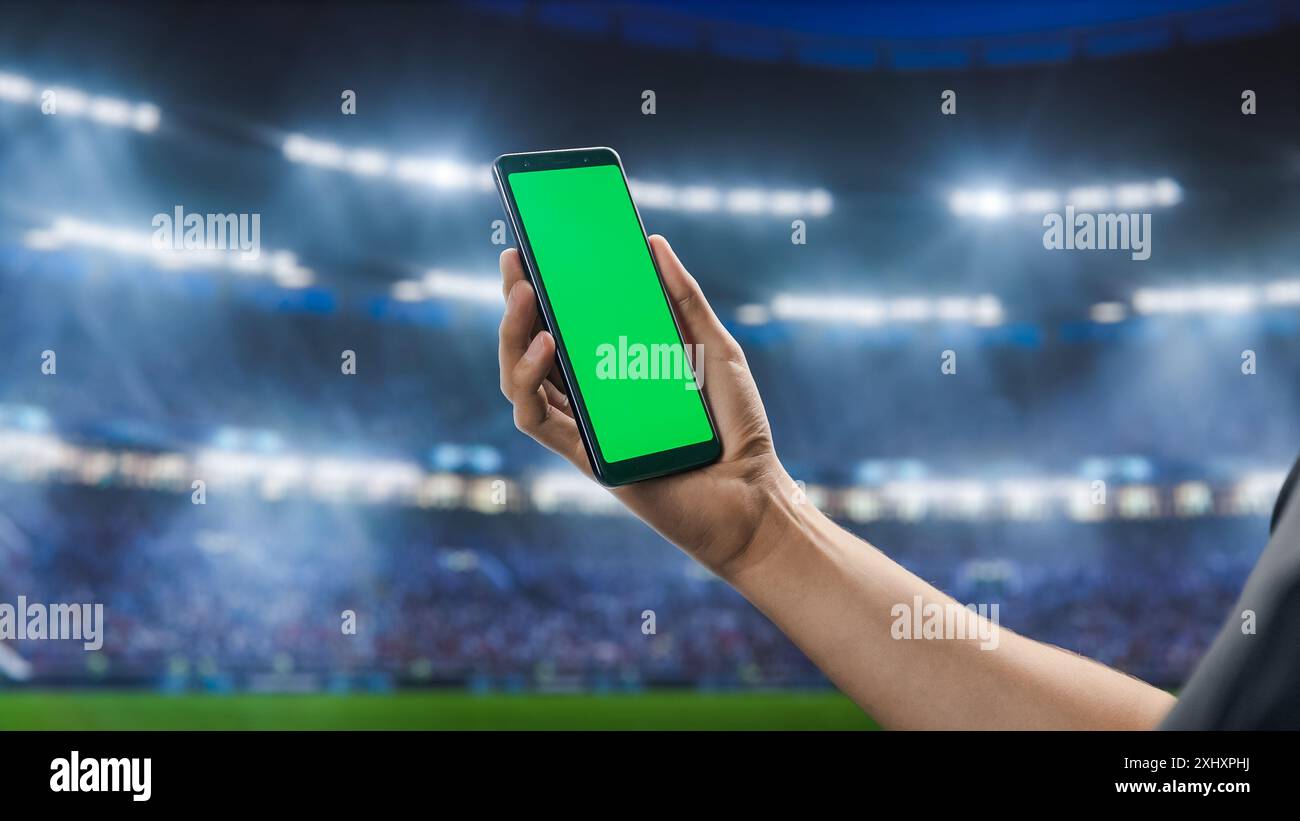 Sport Stadium Championship: Person's Hand Holding Green-Screen Chroma ...