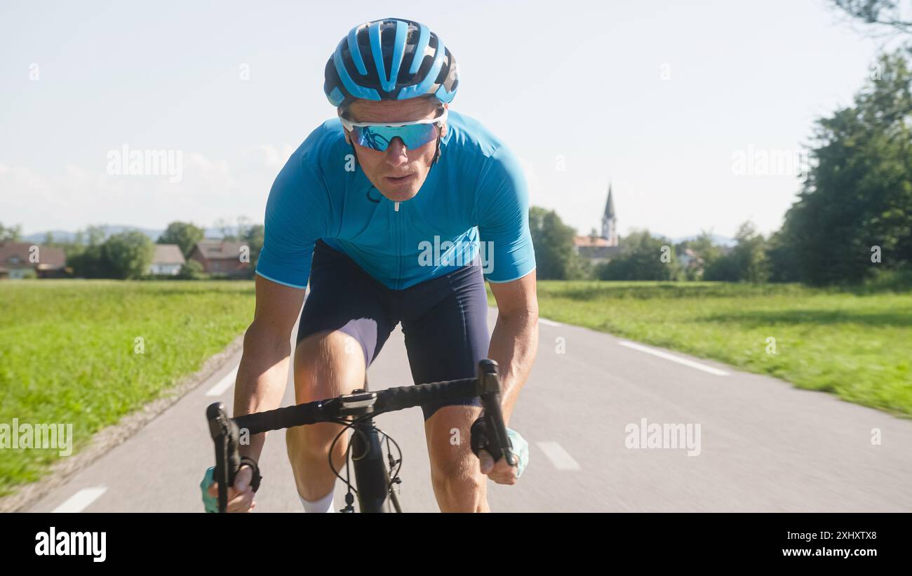 Muscular man, professional racing bicyclist sprint cycling, with ...