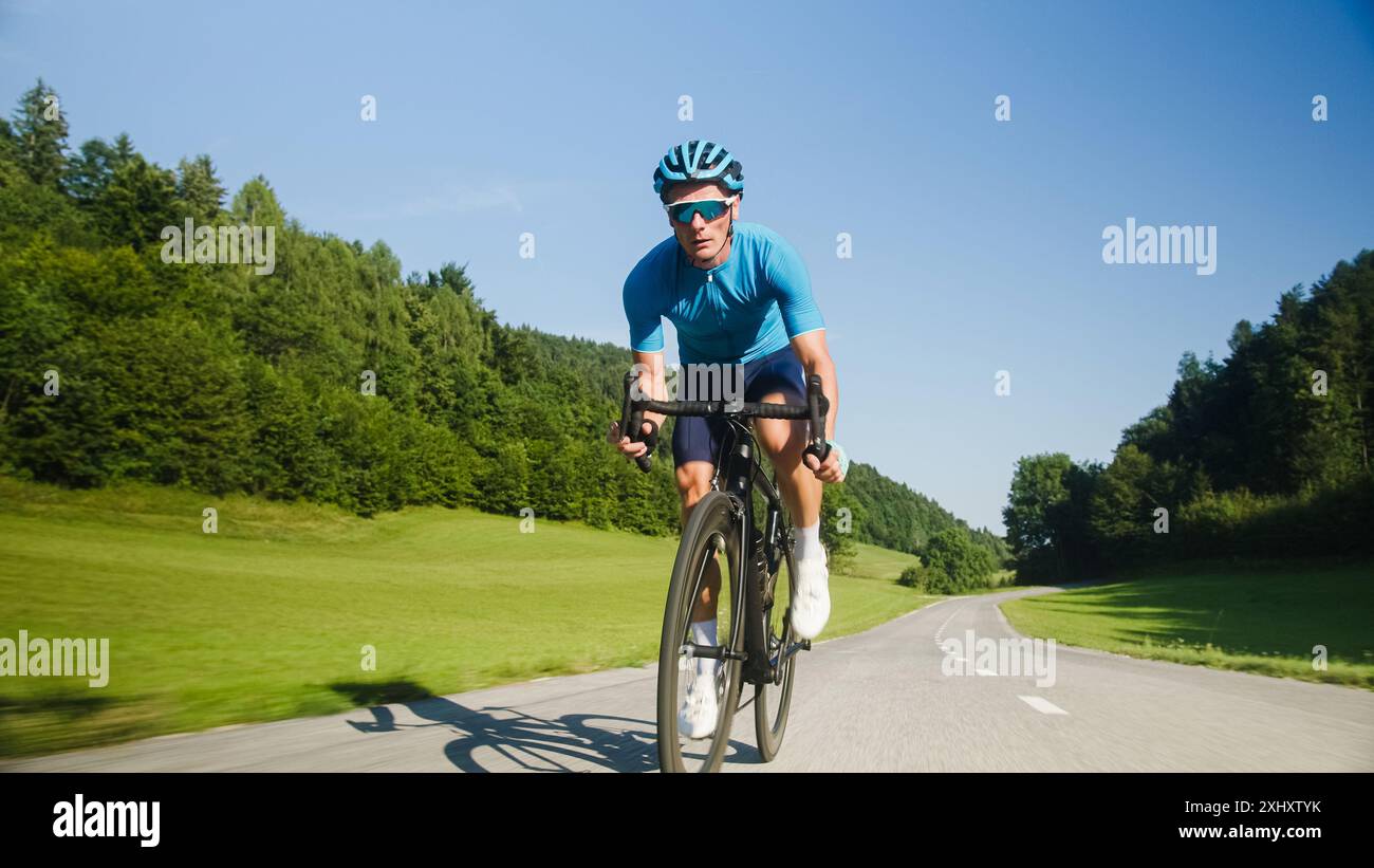 Muscular man, professional racing bicyclist sprint cycling, with ...