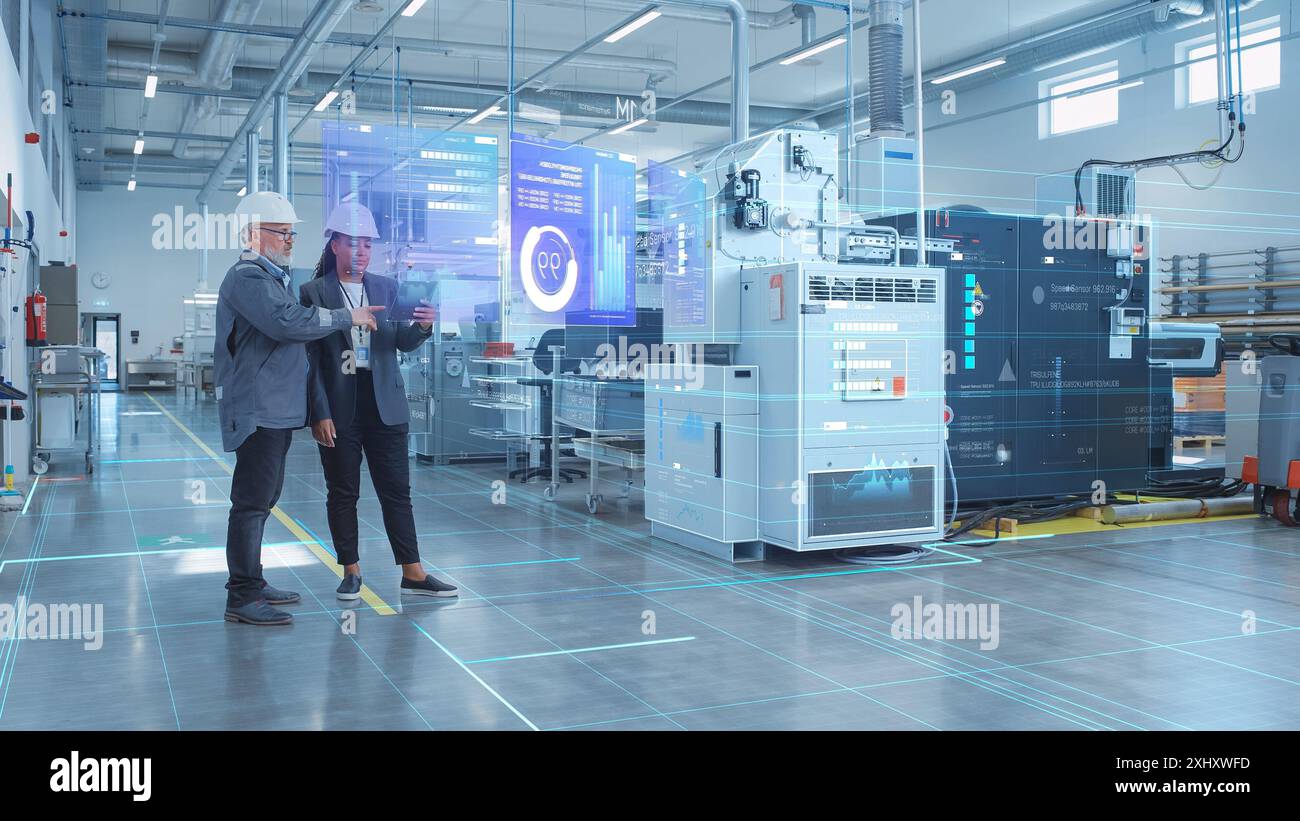 Factory Digitalization: Two Industrial Engineers Use Tablet Computer ...