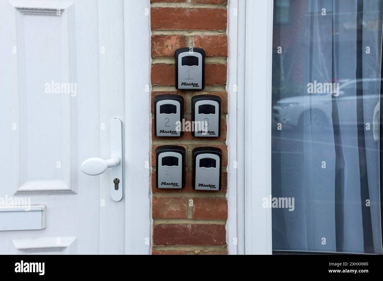 Key Lock Boxes at the entrance of property, Epsom, Surrey, UK Stock ...