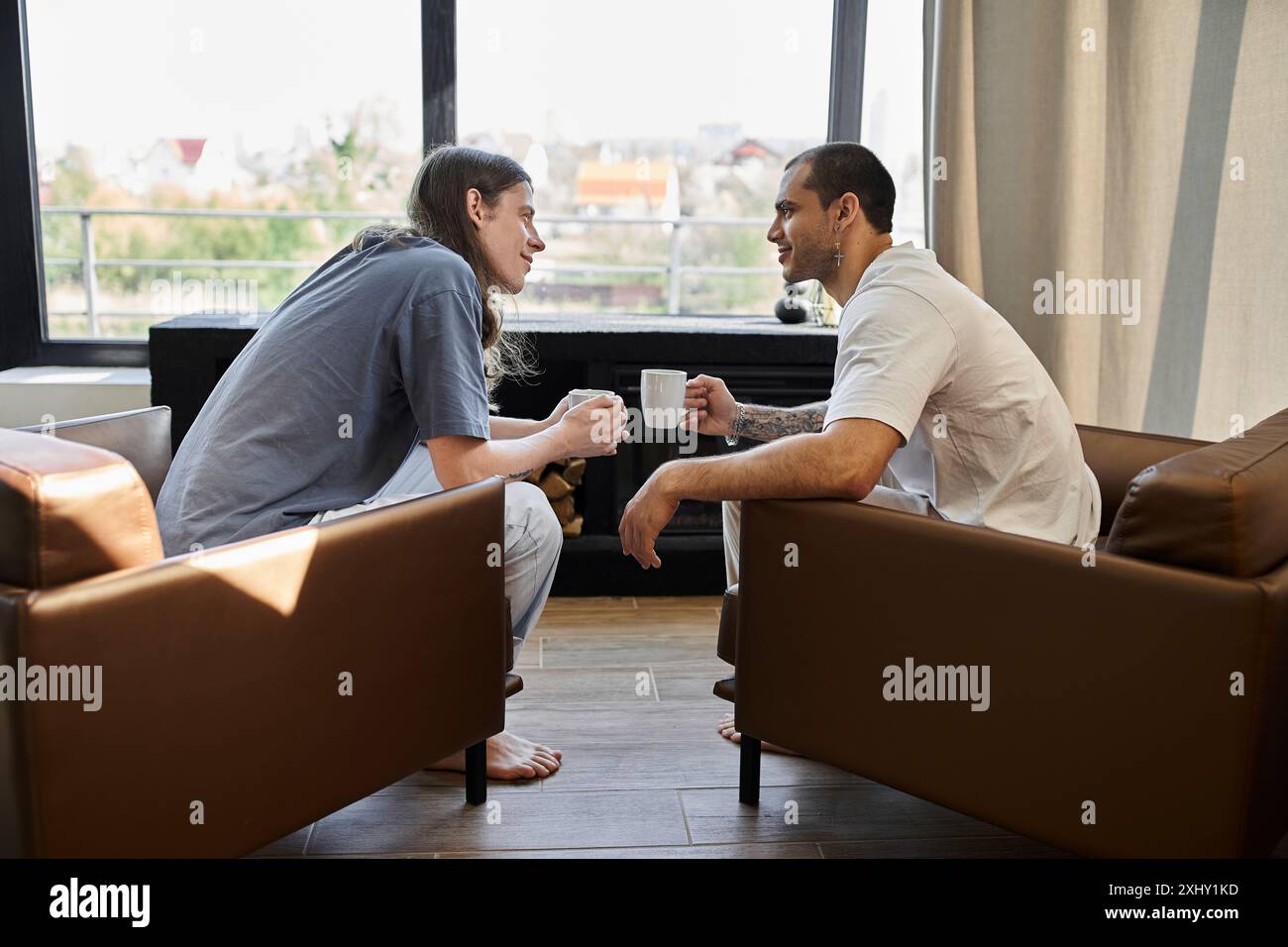 Two men drink coffee together hi-res stock photography and images - Alamy