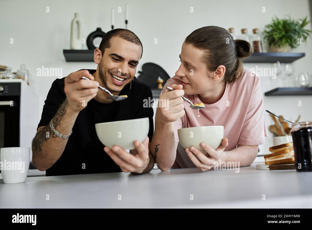 Gay couple eating breakfast home hi-res stock photography and images ...
