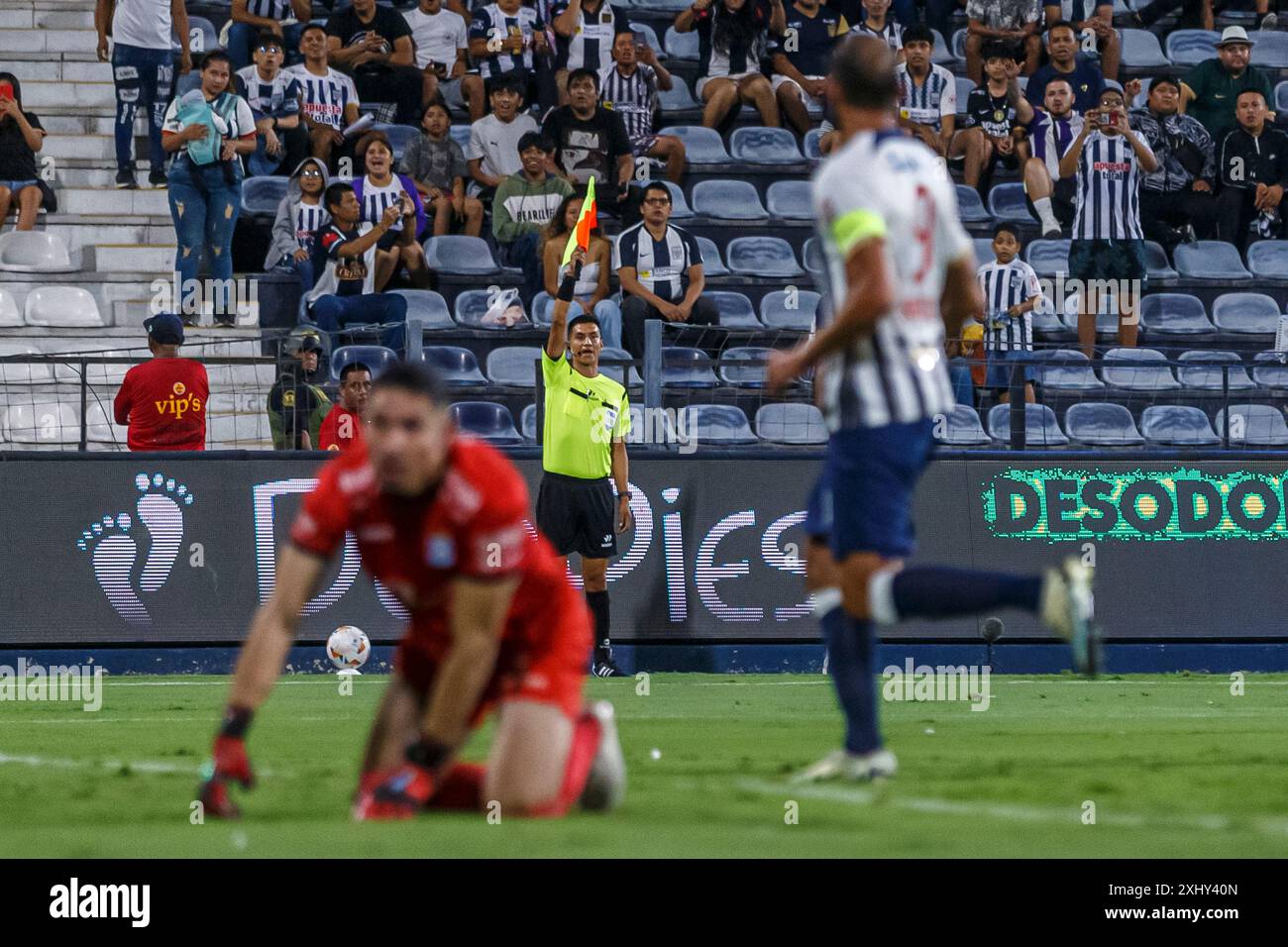 LIMA, PERU - MARCH 20: A linesman signals offside during the Alianza ...
