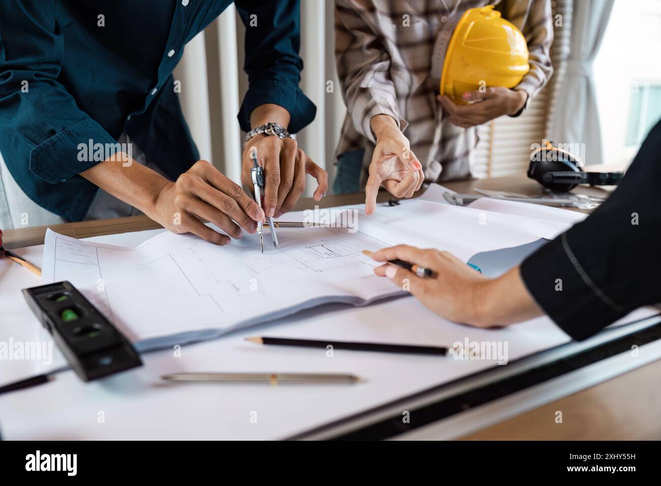 Architect collaboration on Blueprint Design at Construction Site with ...