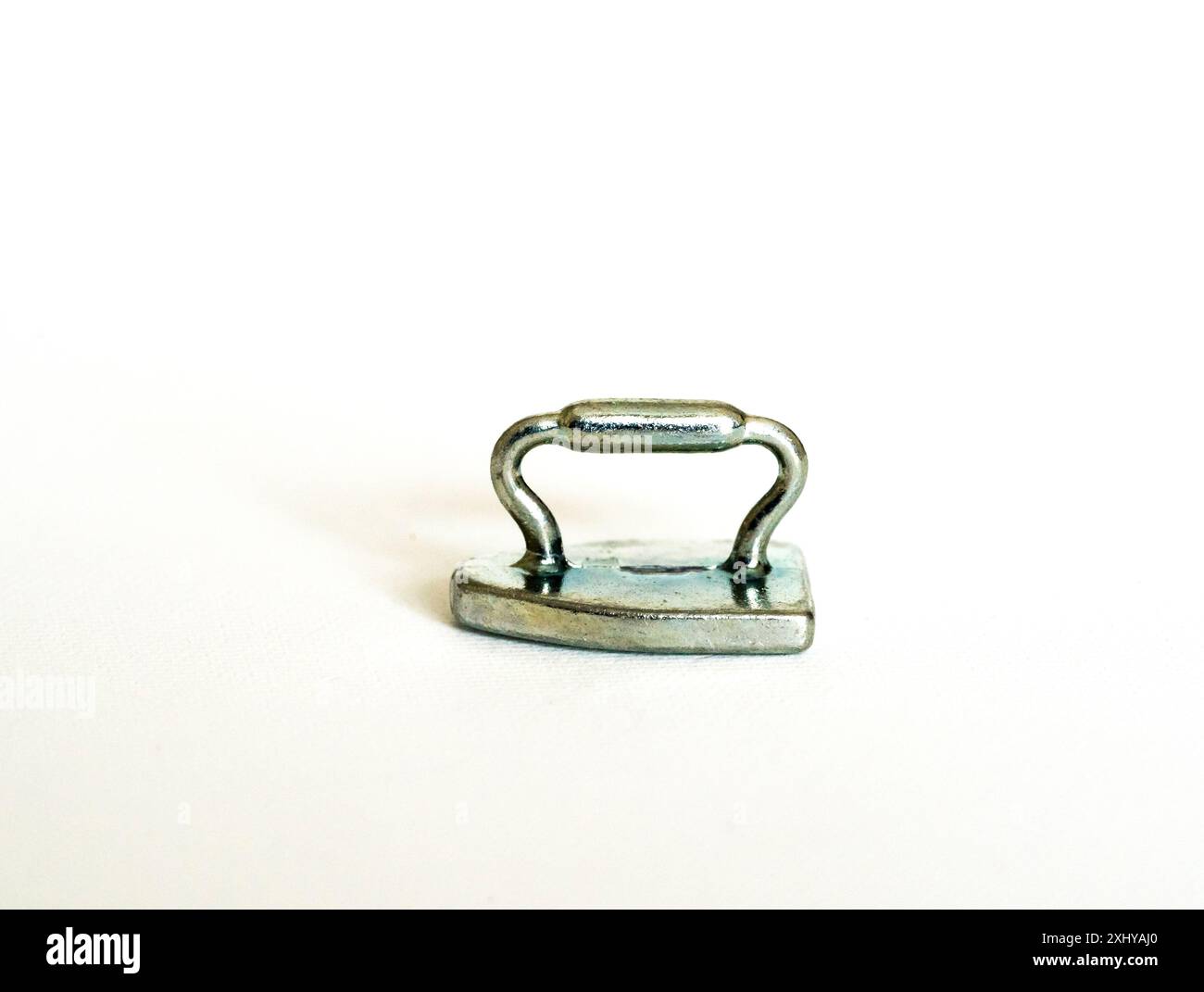 Flat iron board game token Stock Photo - Alamy