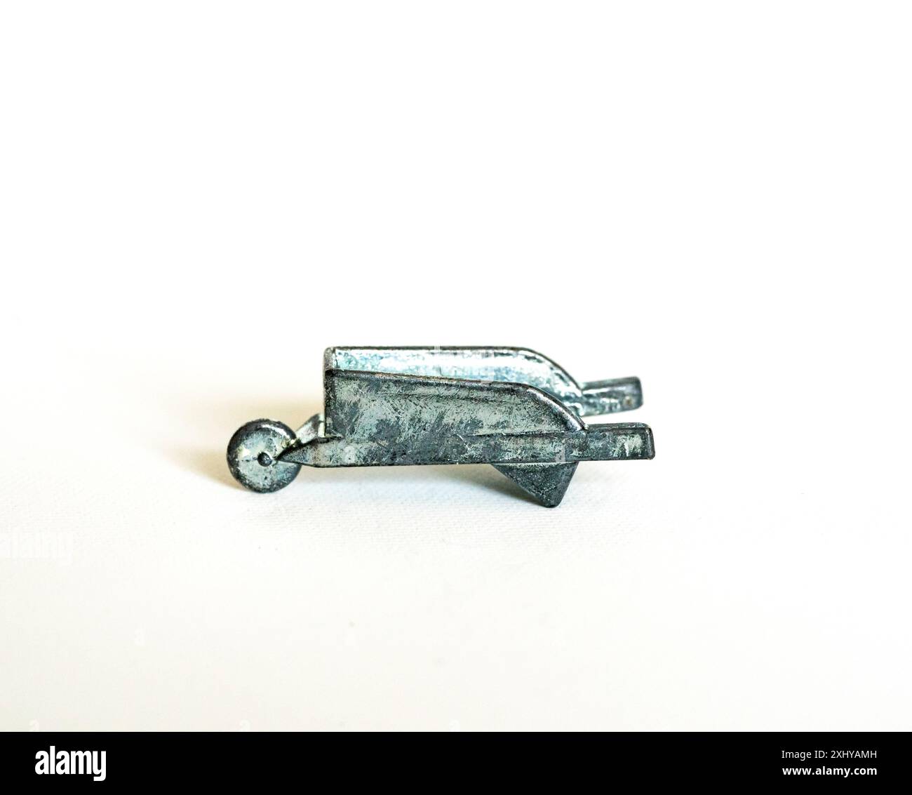 Wheel barrow board game token Stock Photo - Alamy