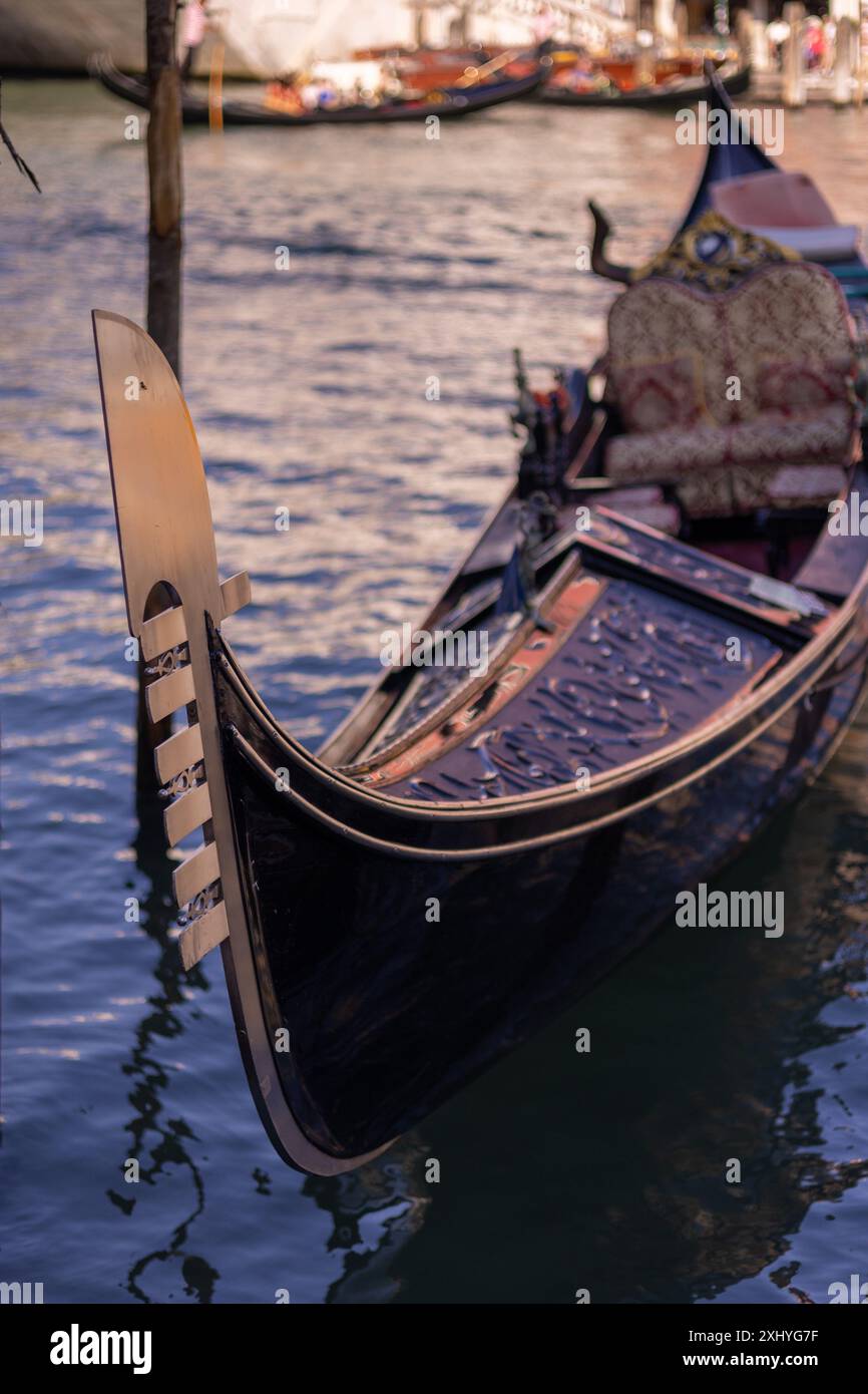 Traditional wooden gondola boat docked in Venice, Italy Stock Photo - Alamy