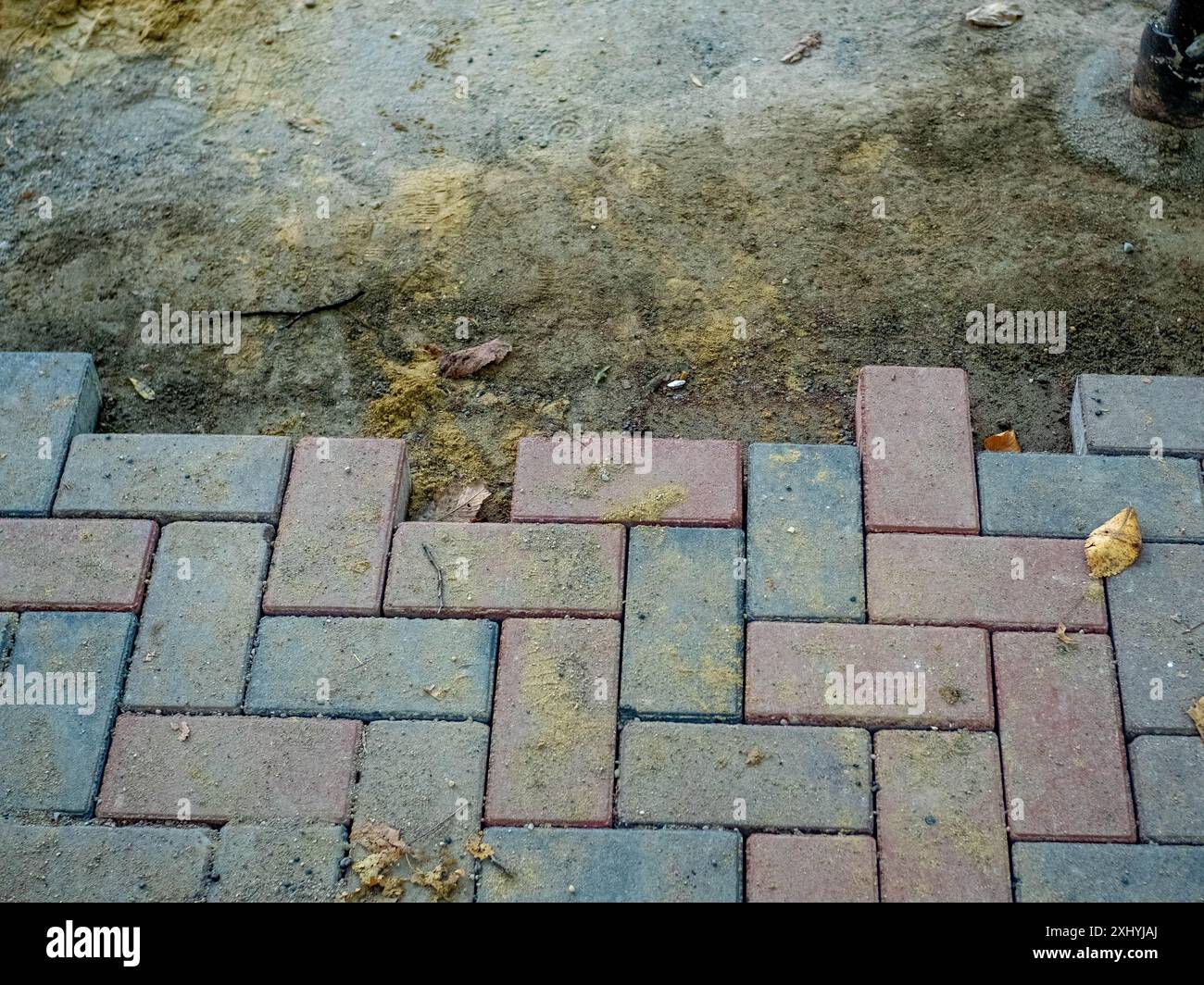 Correct installation of pavers over a bed of sand Stock Photo - Alamy