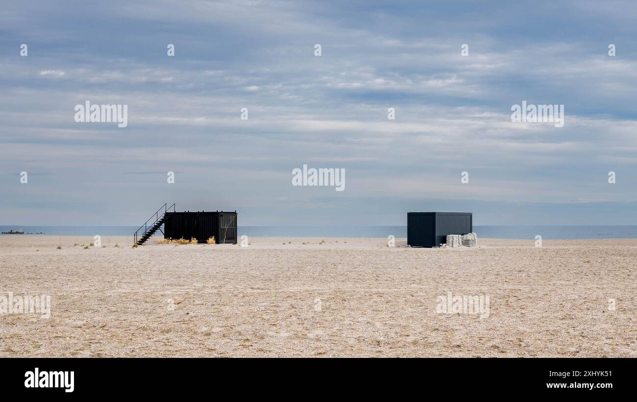 Two containers on the sea shore Stock Photo - Alamy