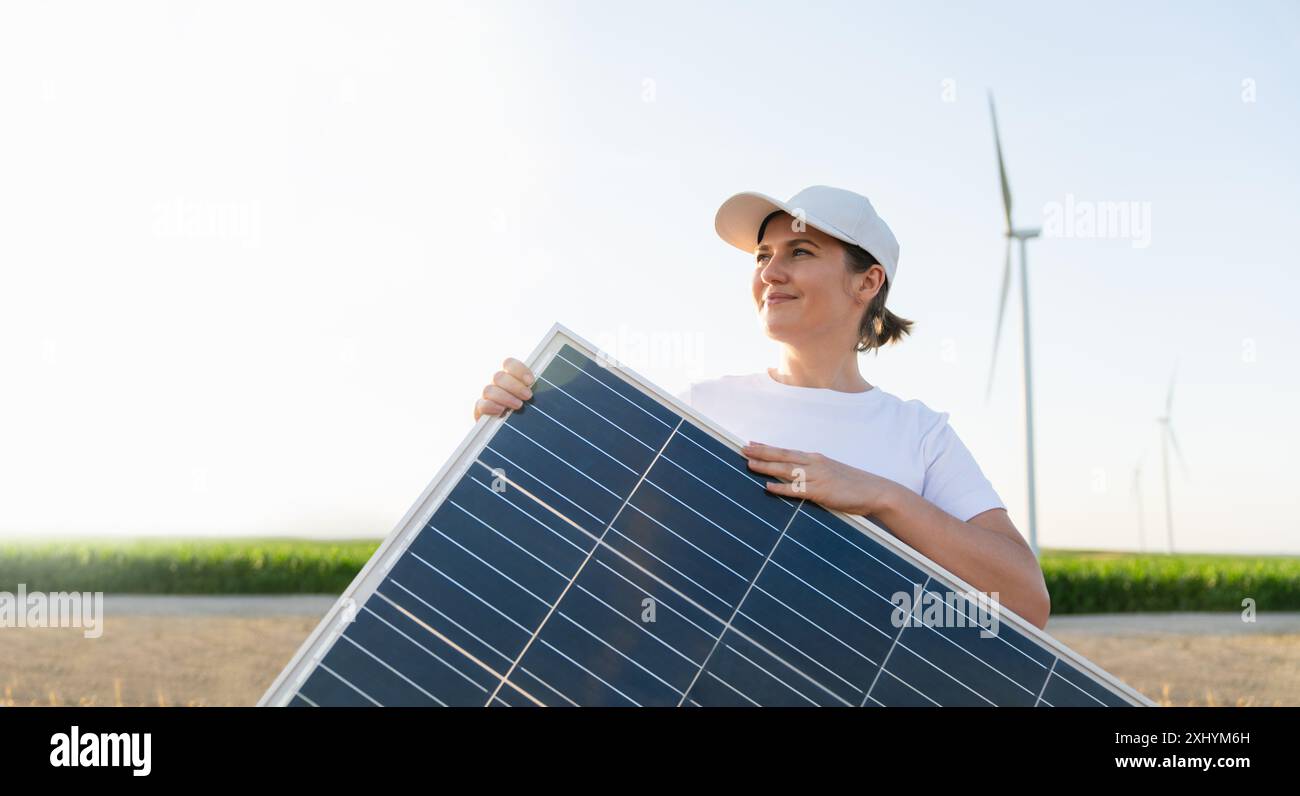 Female farmer wearing white cap with solar panel Stock Photo - Alamy