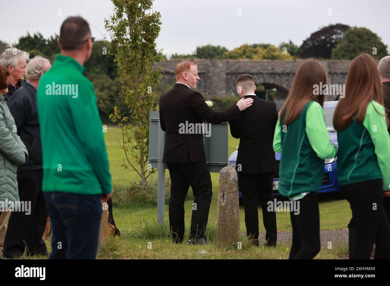 Mourners leave a single yellow rose at the Glen playing area, for 13 ...