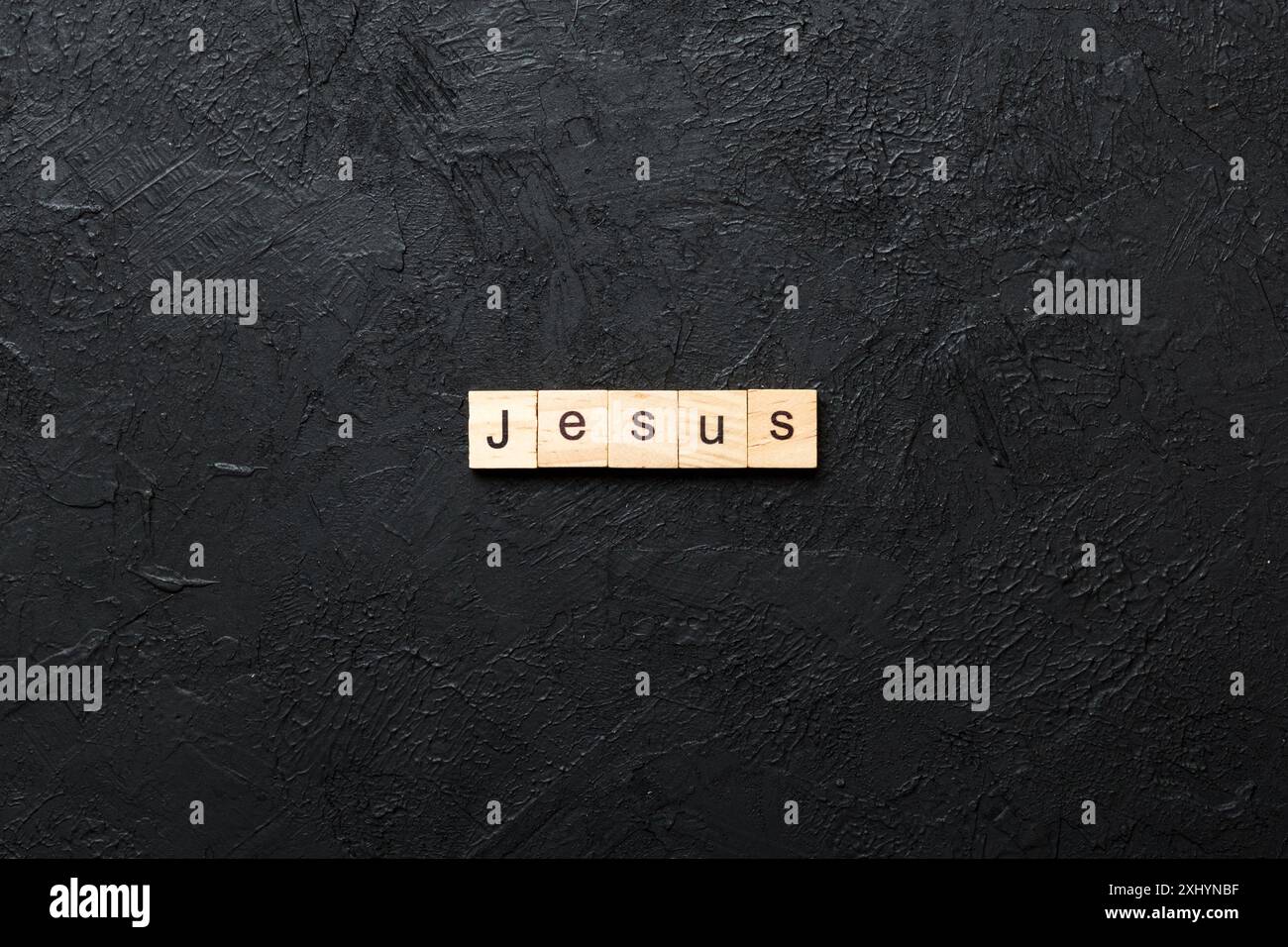 Jesus word written on wood block. Jesus text on table, concept Stock ...