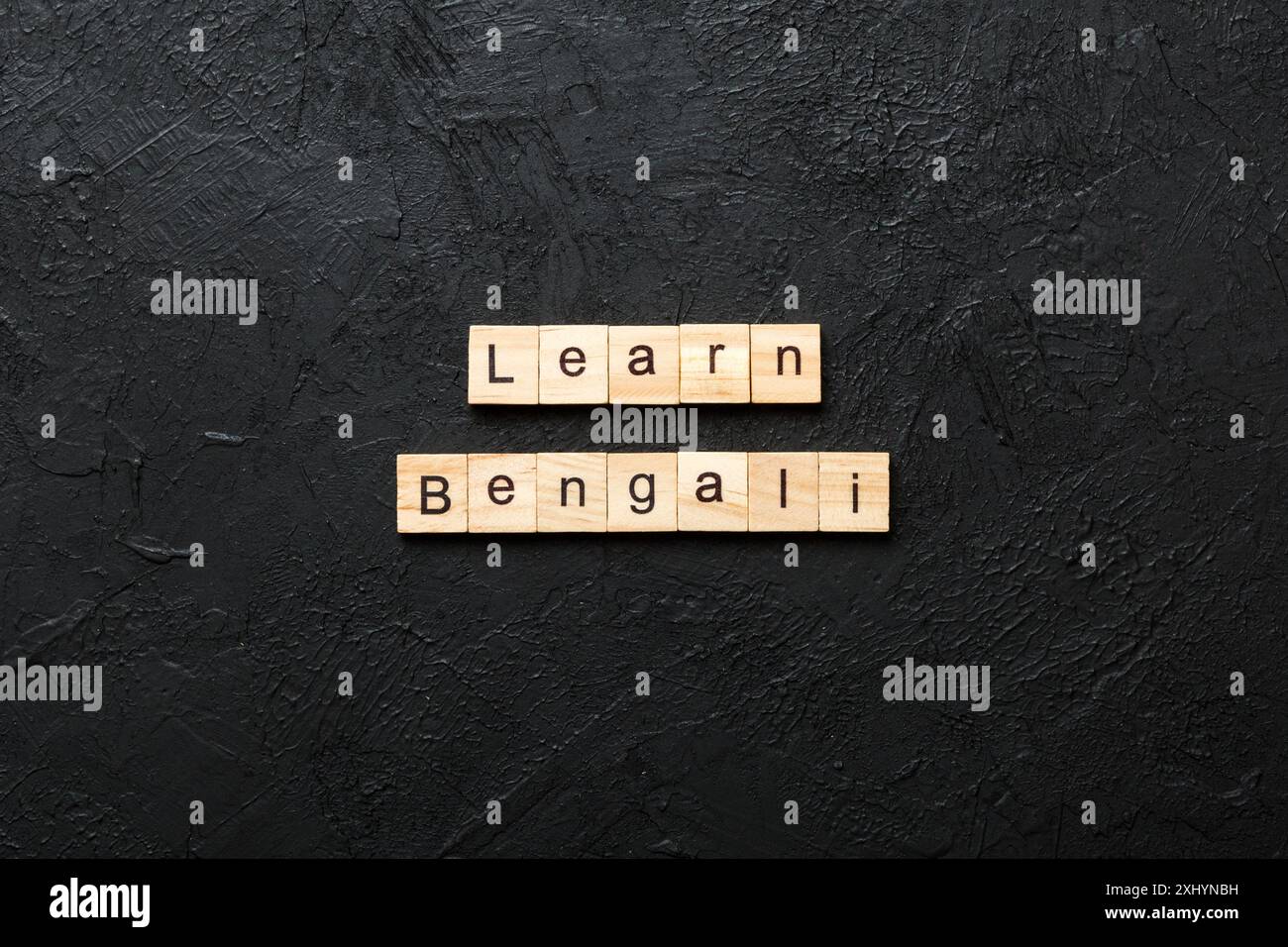 learn Bengali word written on wood block. learn Bengali text on table ...