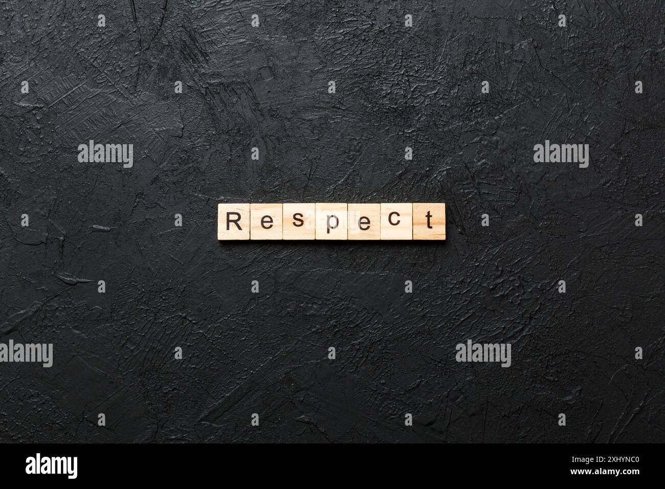 respect word written on wood block. respect text on table, concept ...