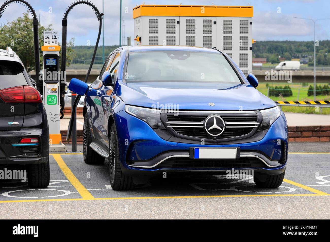 Blue Mercedes-Benz EQC 4-matic electric SUV car charging battery at ...