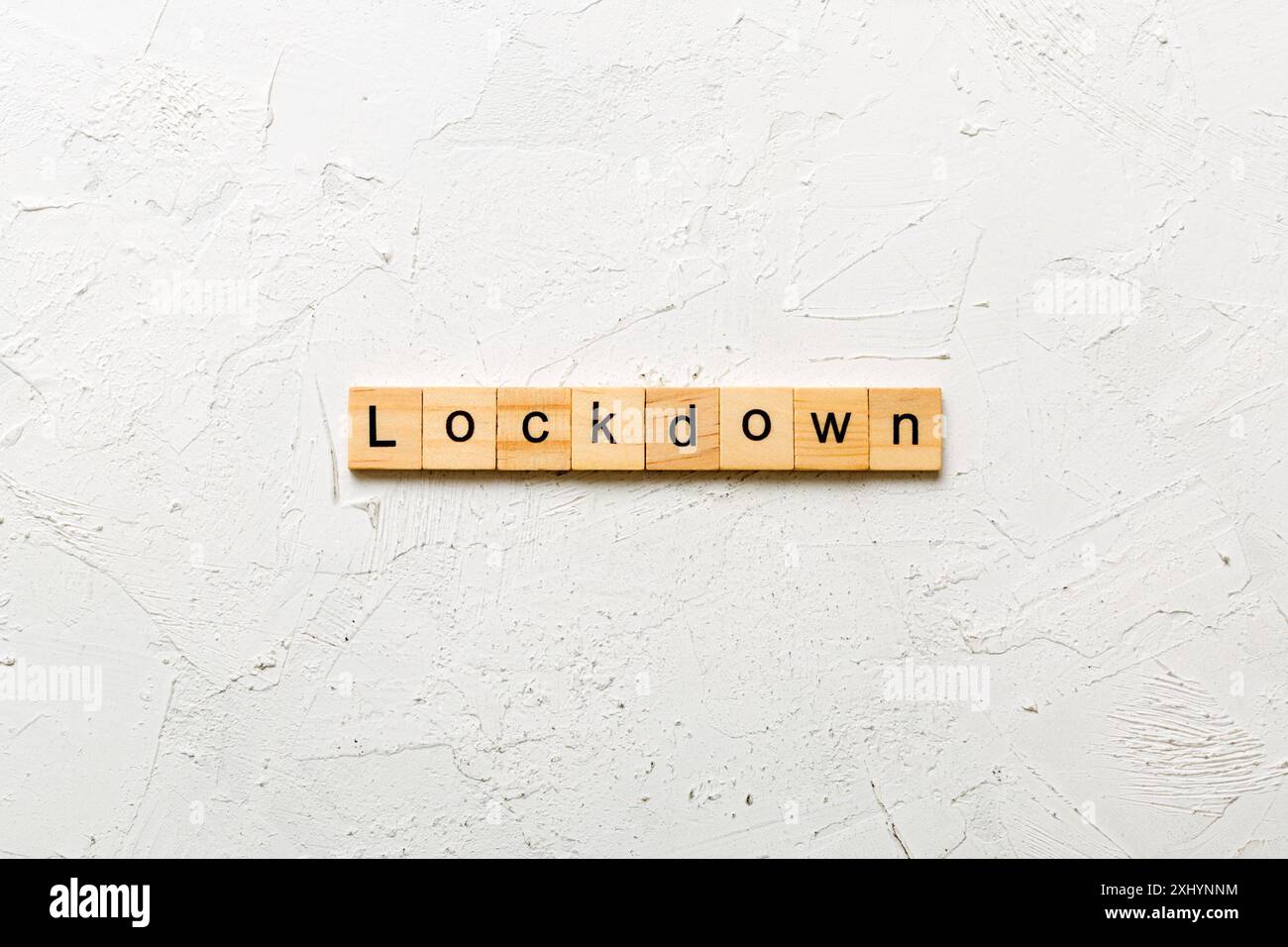 lockdown word written on wood block. lockdown text on table, concept ...