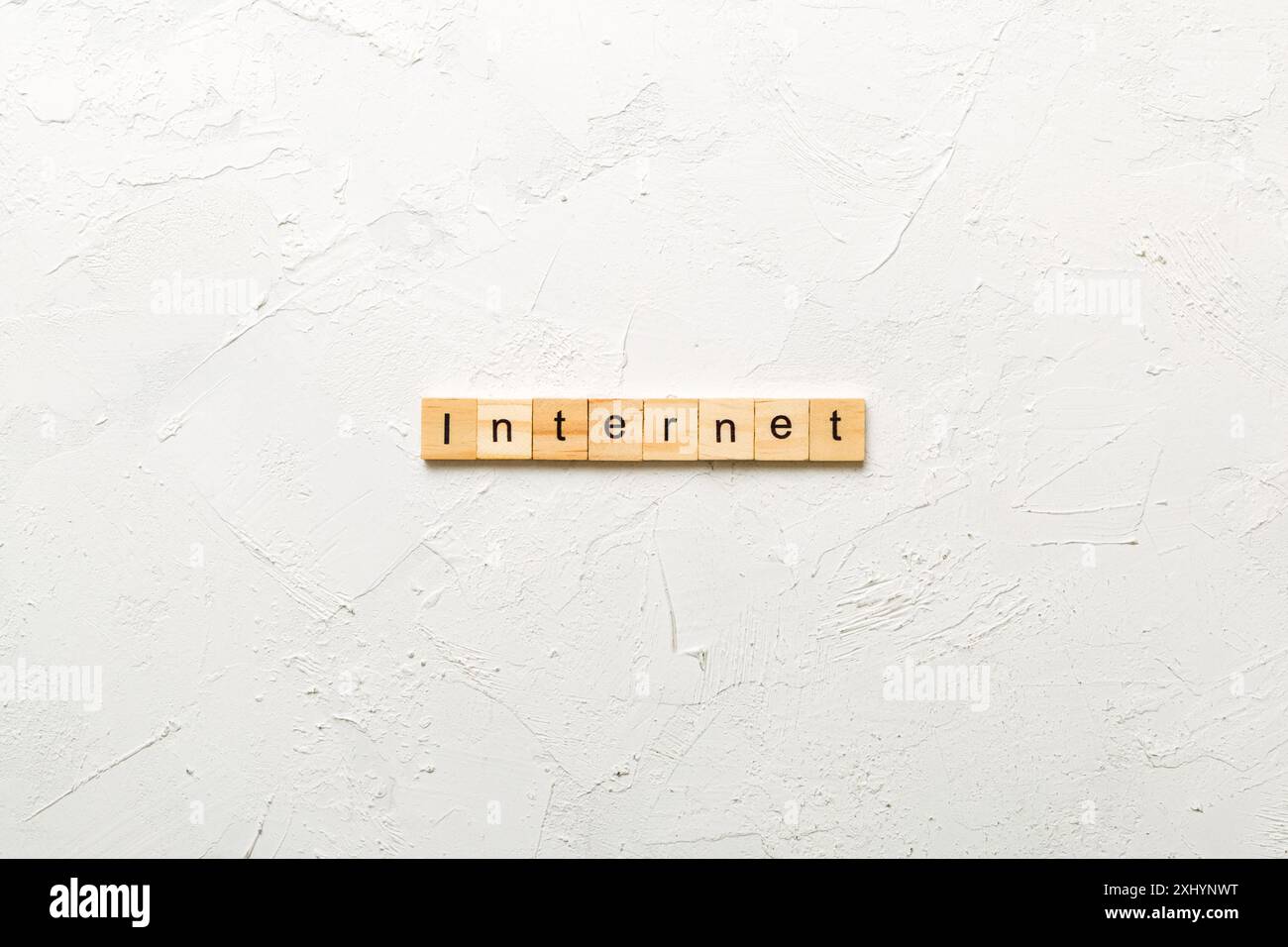 INTERNET word written on wood block. INTERNET text on cement table for ...