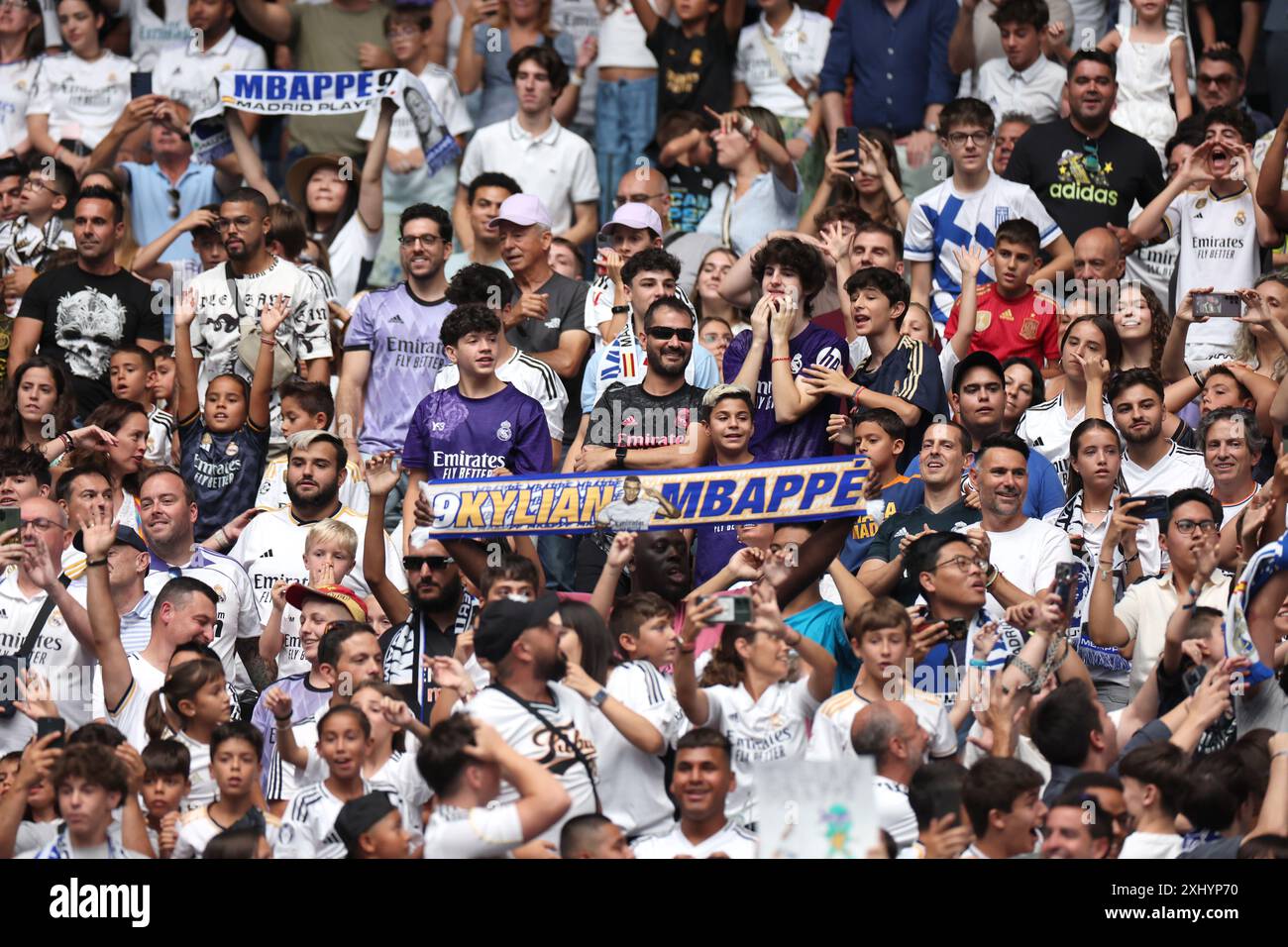 Fans watch new Real Madrid player Kylian Mbappe during a presentation ...