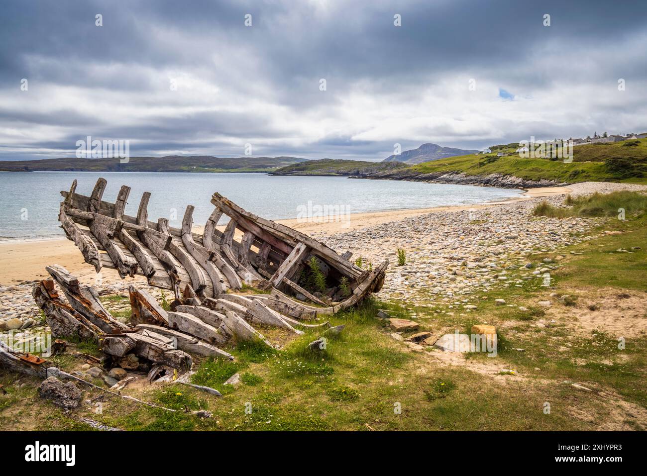 A wrecked boat on Talmine Beach on Tongue Bay, Sutherland, Scotland ...