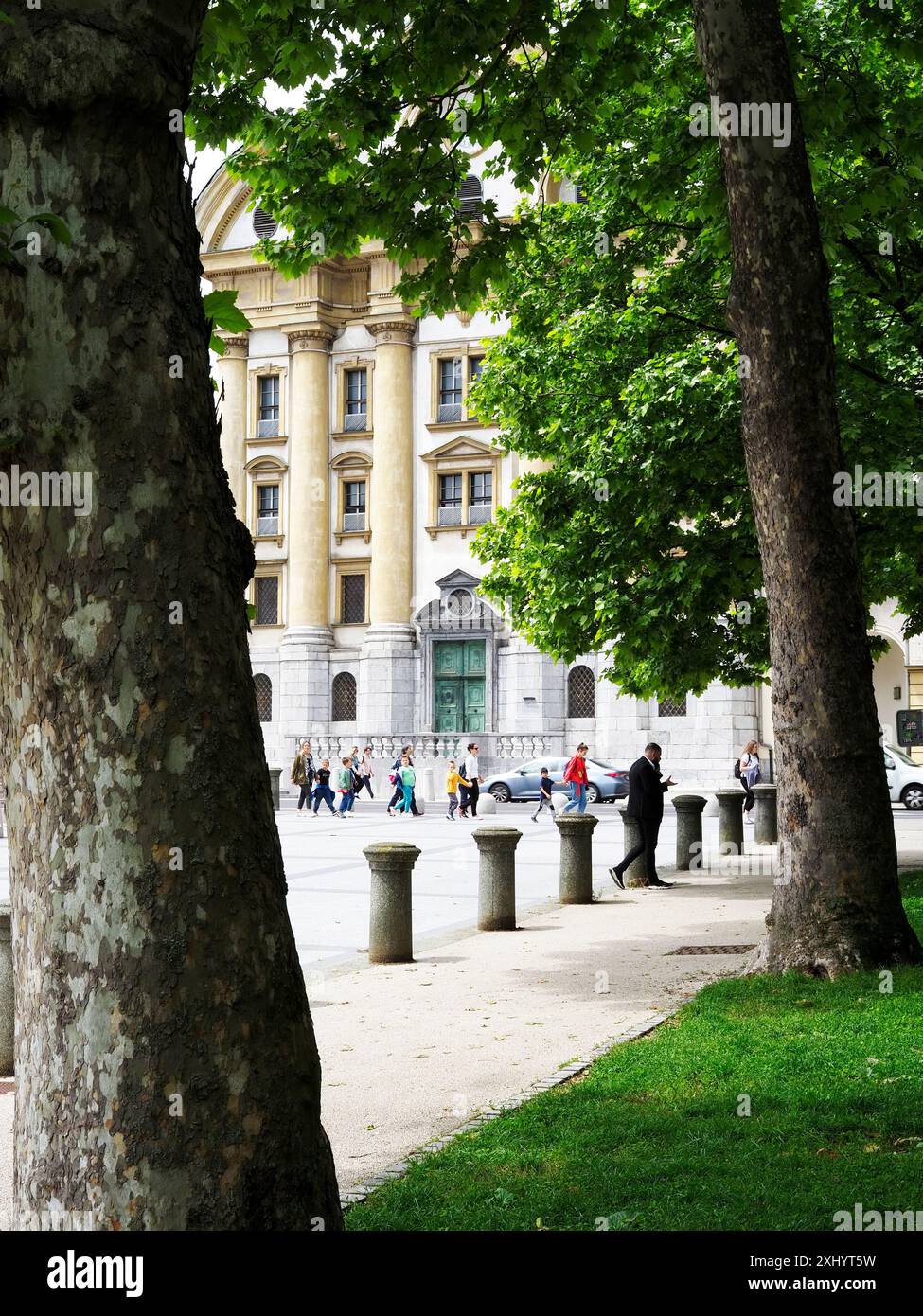 View through trees in Star Park to the Ursuline Church of the Holy Trinity in Congress Square ...