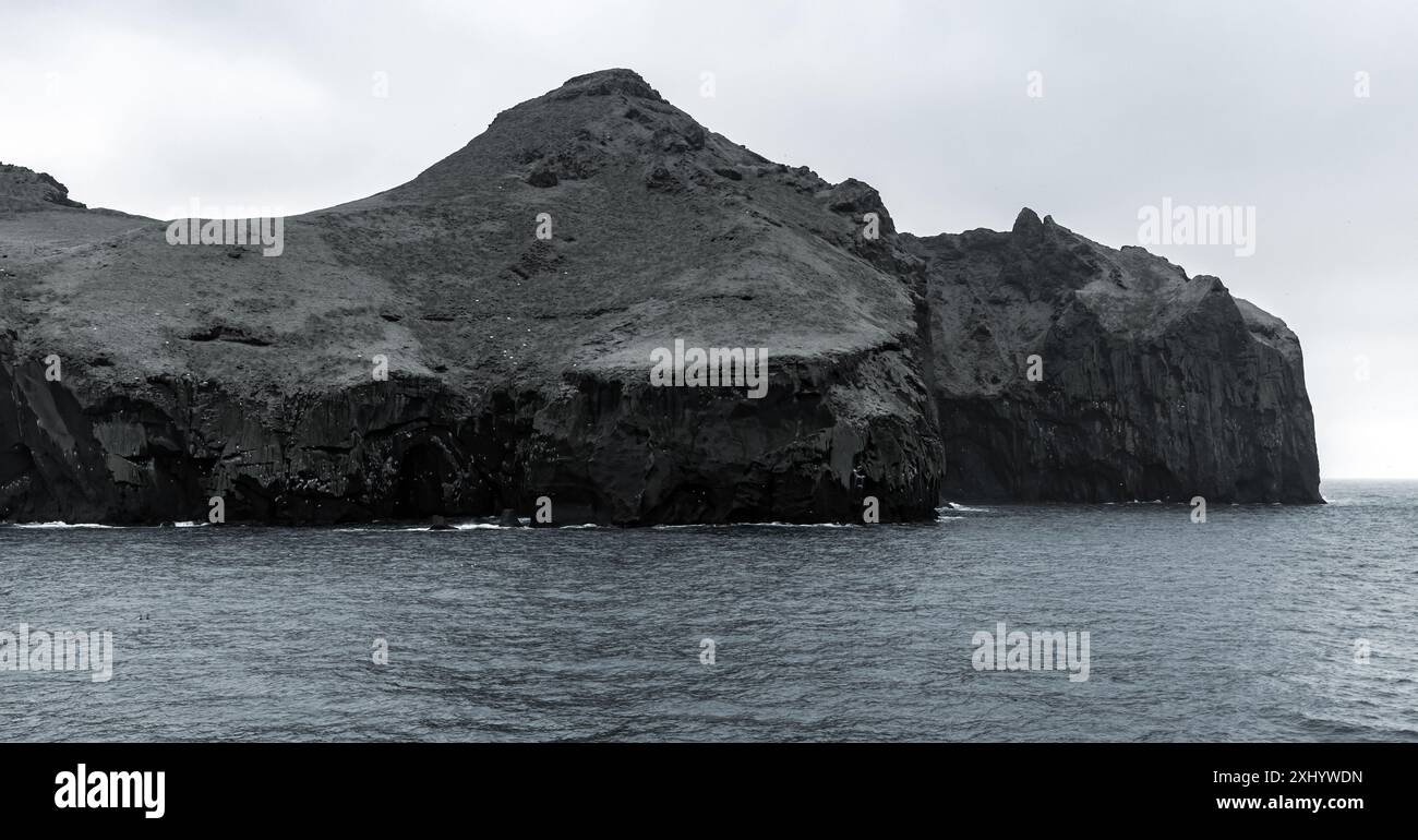 Rocky coasts of Vestmannaeyjar island. Natural dark landscape of ...