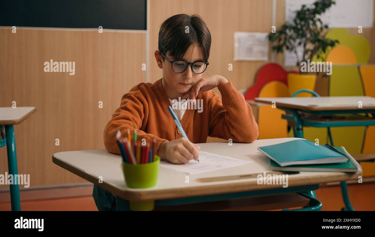 Back to school elementary primary education studying Caucasian boy ...