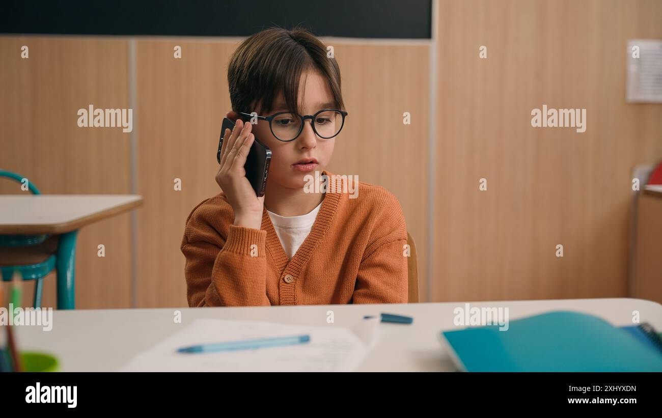 Little Caucasian boy in eyeglasses son primary school guy kid schoolboy child baby pupil student ...