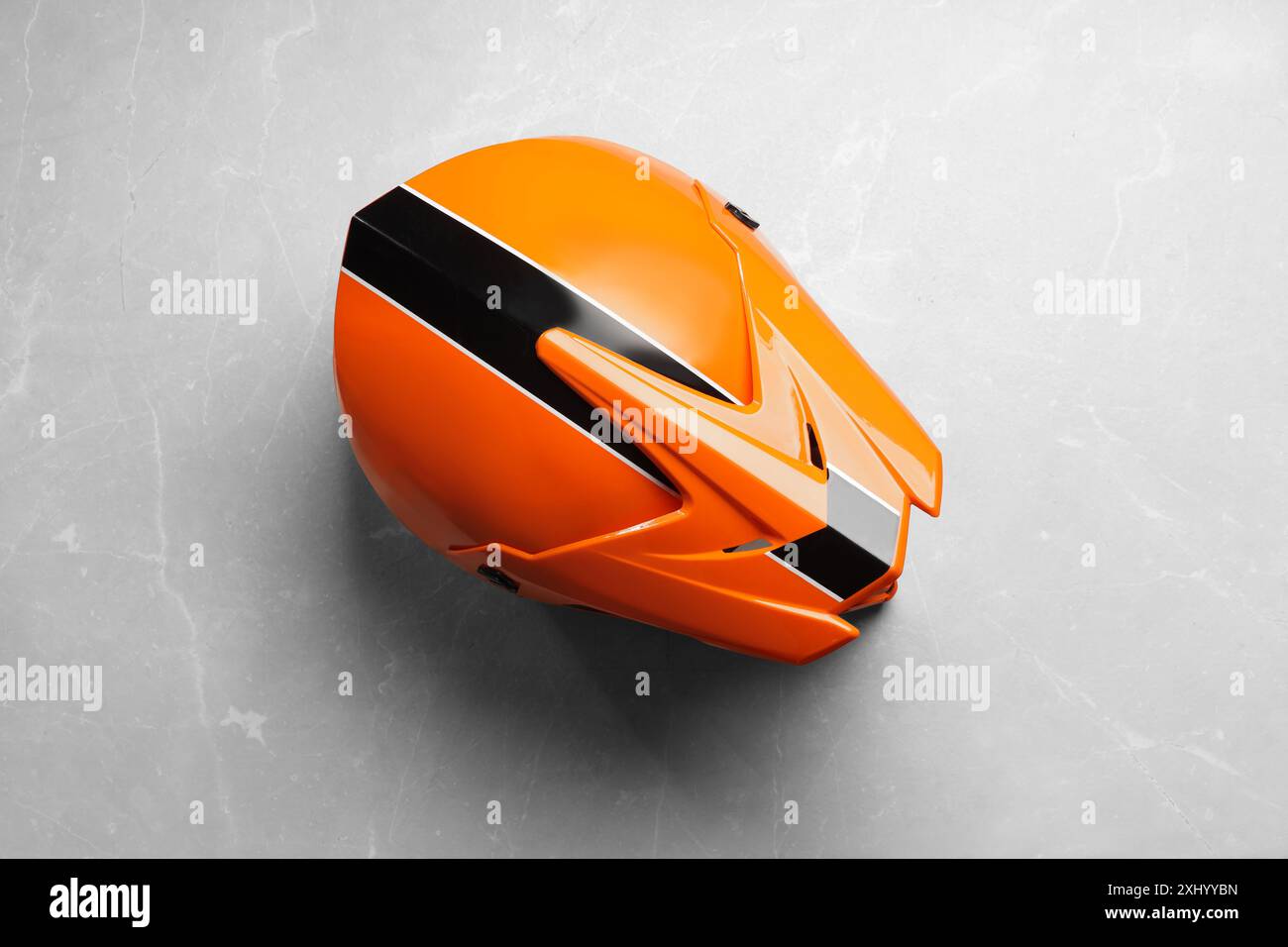 Modern motorcycle helmet with visor on light grey surface, top view ...