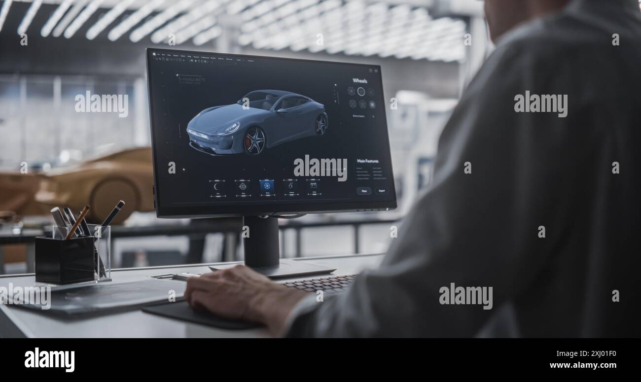 Automotive Designer Working on a Desktop Computer with 3D Customization ...