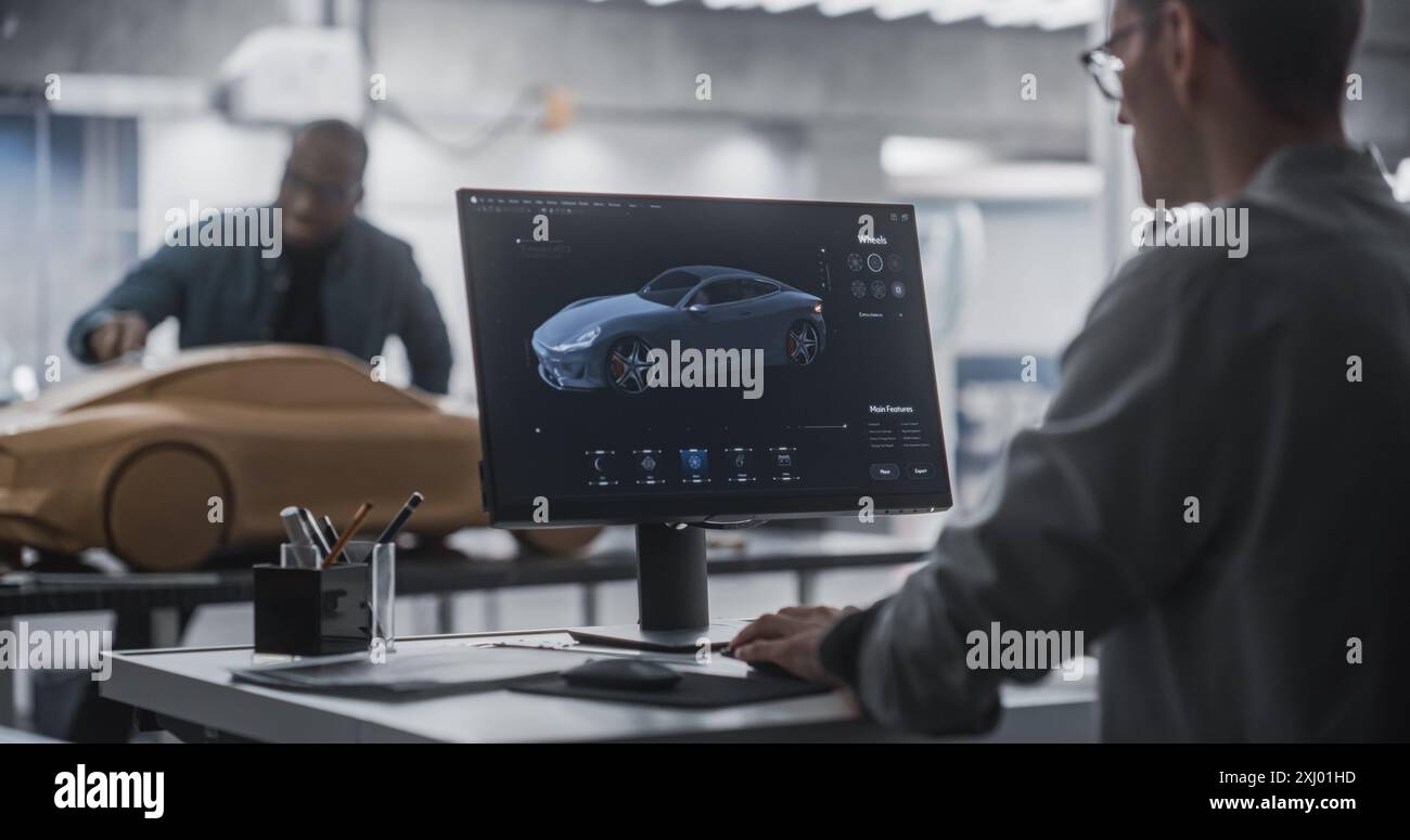 Automotive Designer and Modeler Working as a Team on Creating a ...