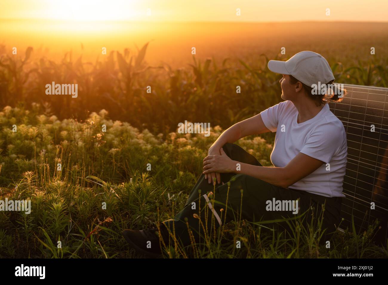 Female farmer wearing white cap with solar panel Stock Photo - Alamy