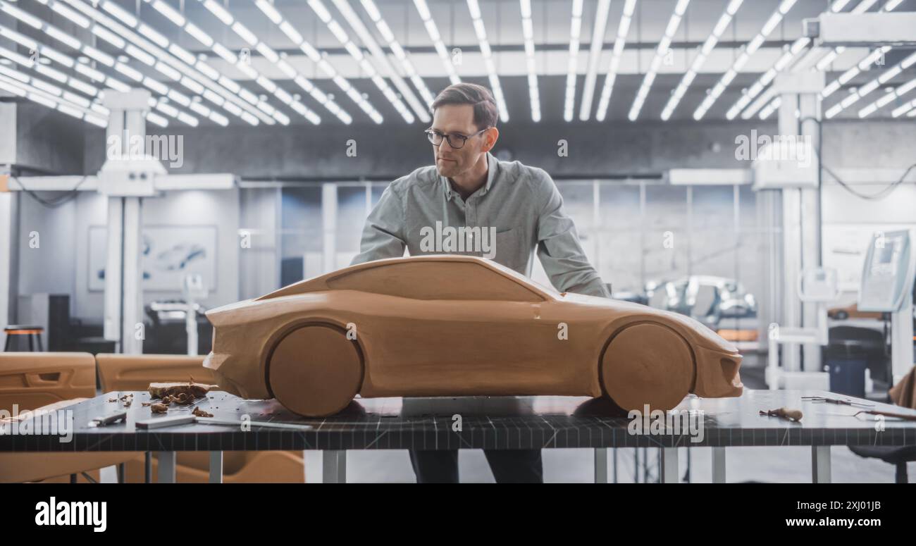 Handsome Automotive Designer in Glasses Working on a Prototype Car Out ...